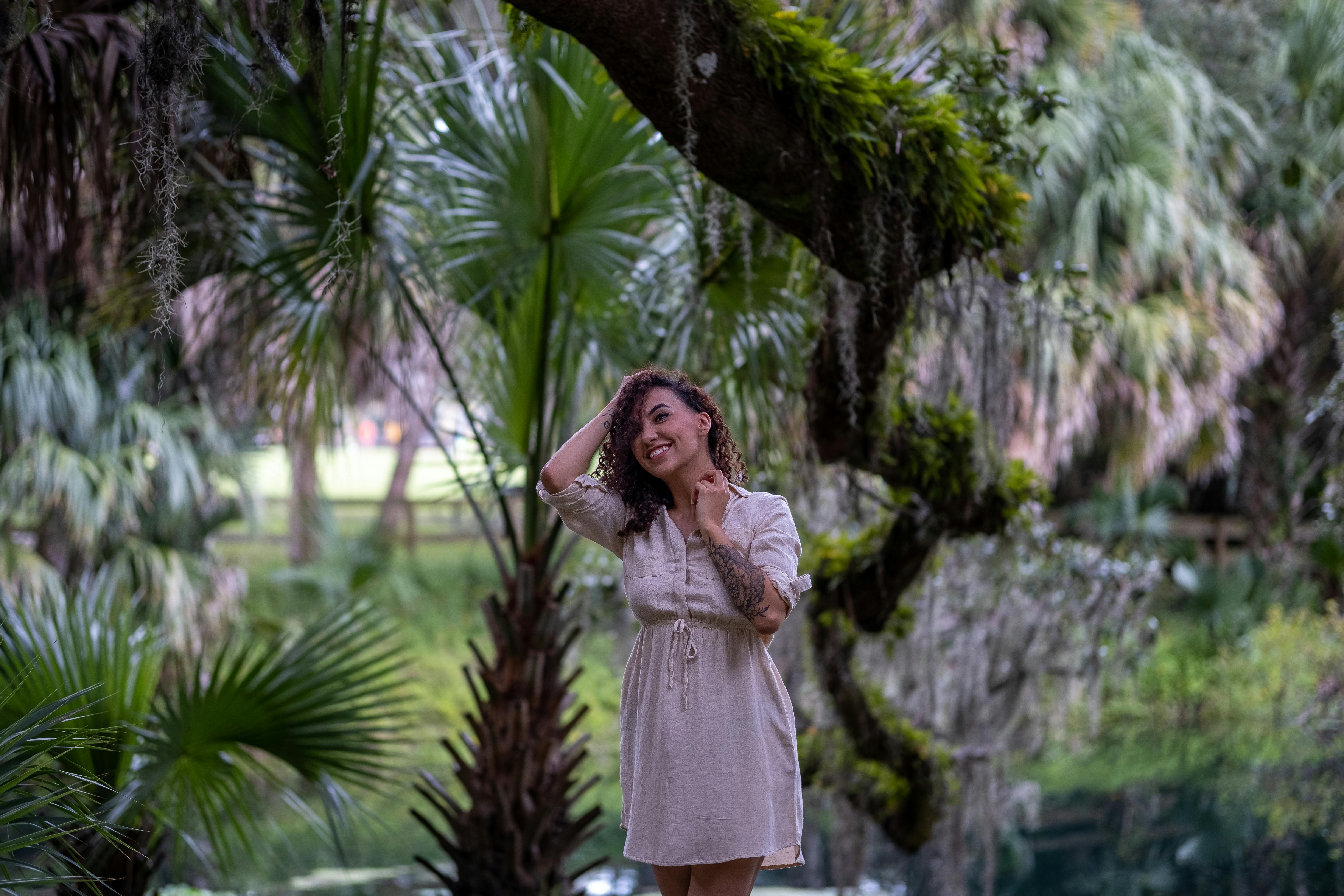 Woman Beside the Tree Trunk · Free Stock Photo