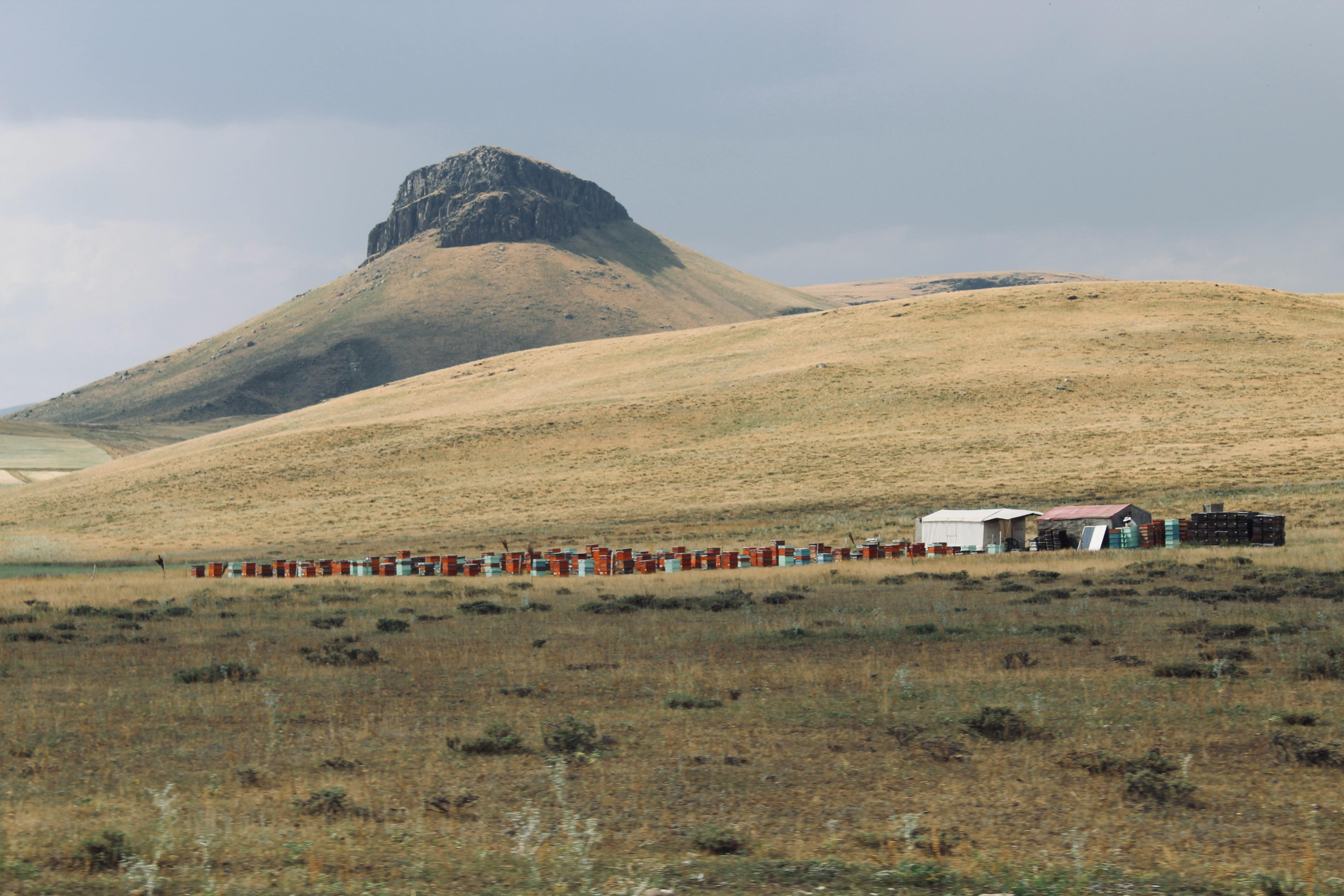 Rock Formation on Top of a Grass Hill · Free Stock Photo