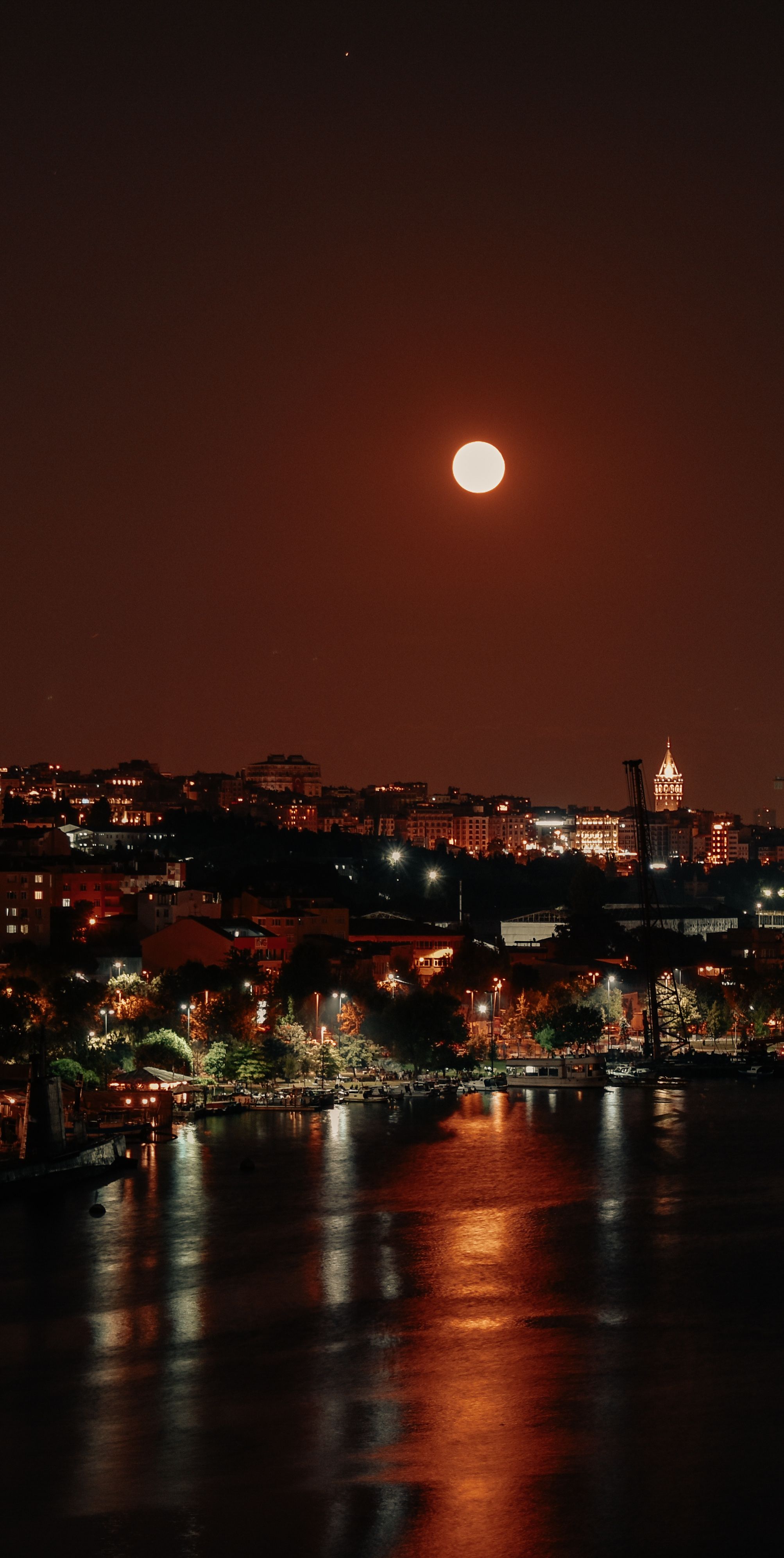 An Bright Moon Over City Buildings Near River · Free Stock Photo