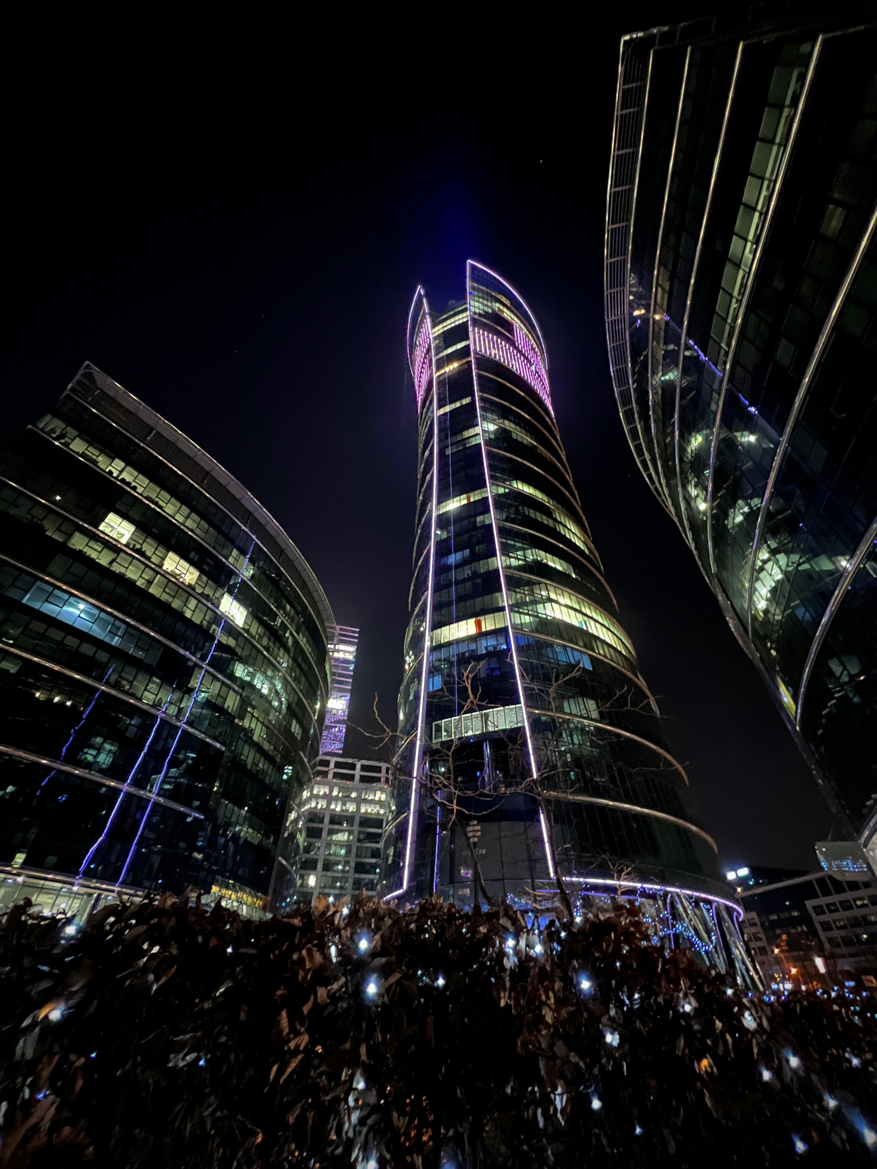 Glass Buildings Under Dark Sky · Free Stock Photo