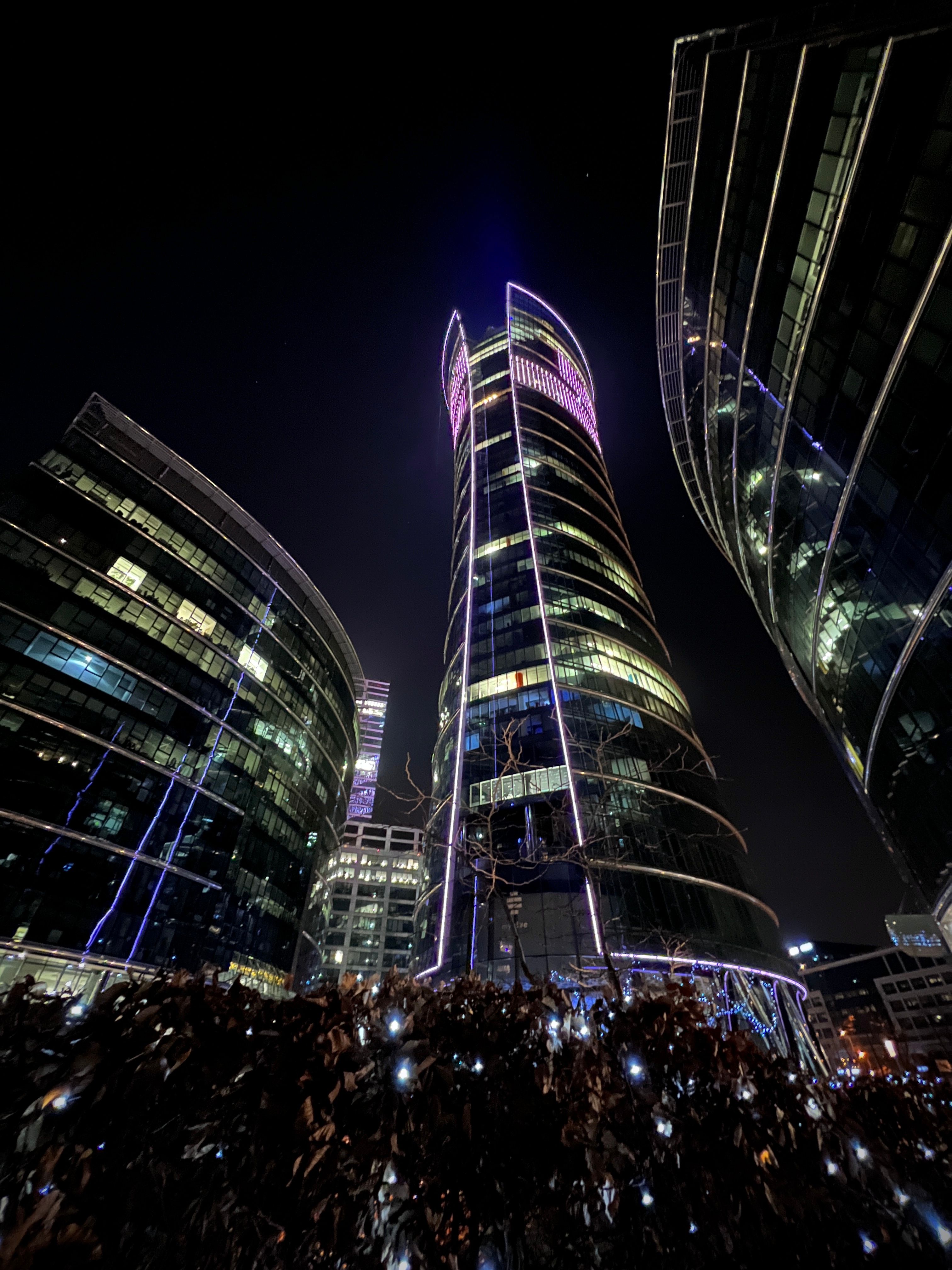 Modern Glass Skyscraper with Lights on Dark Sky Background · Free Stock ...