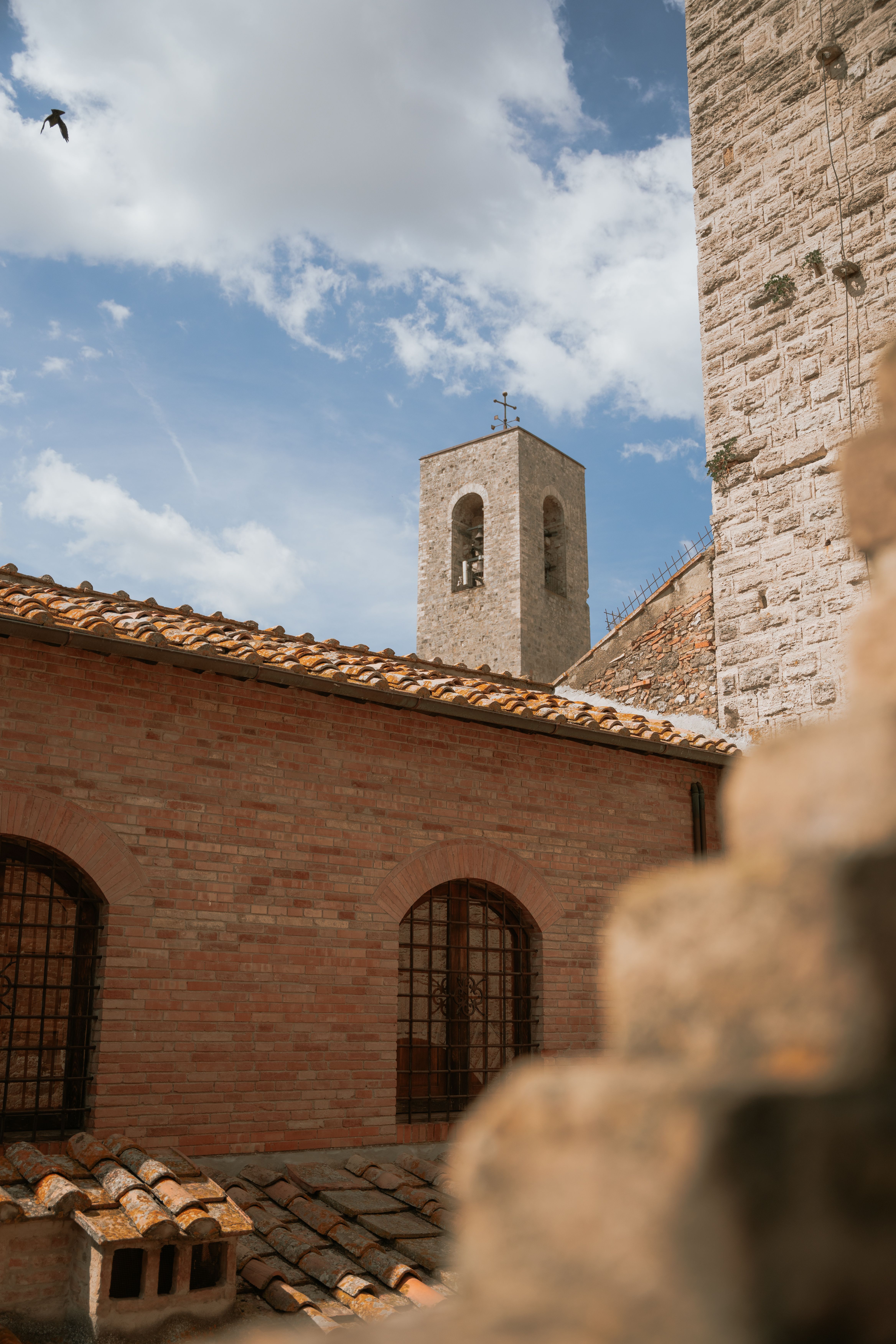 Brick Bell Tower Under Blue Sky · Free Stock Photo