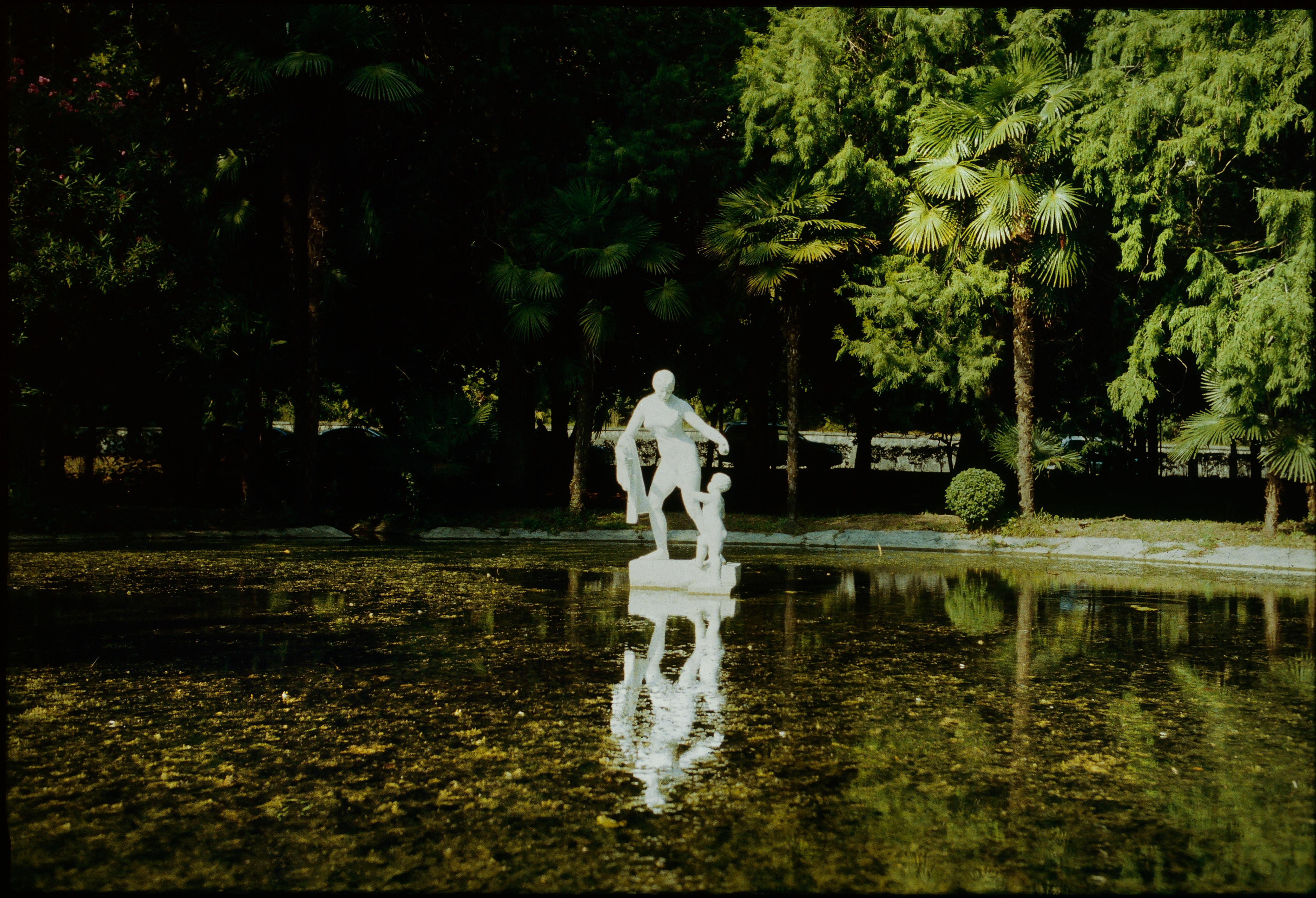 Statue of a Mother and Child on Water · Free Stock Photo