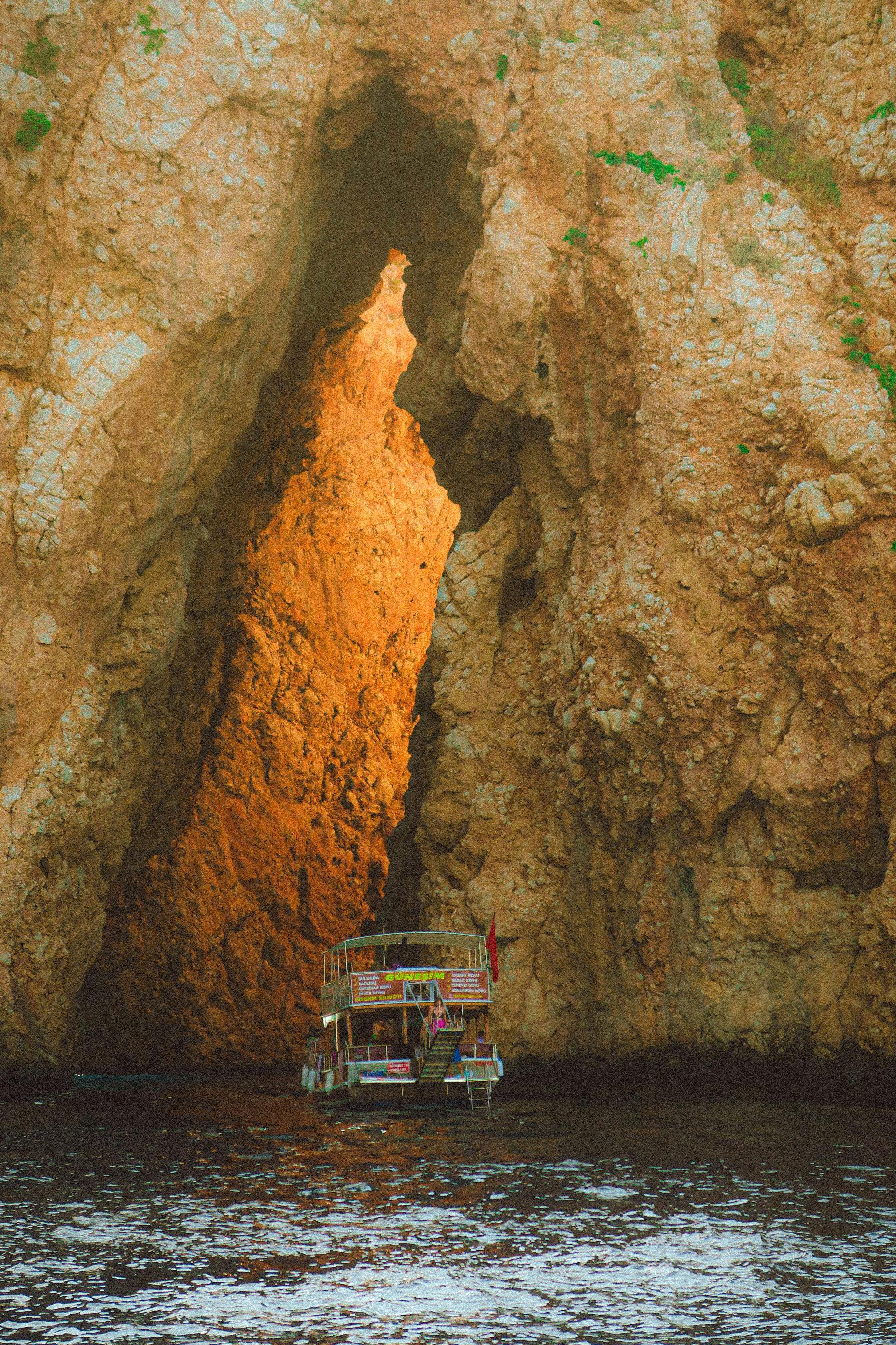 Photo Of Person Inside Cave · Free Stock Photo