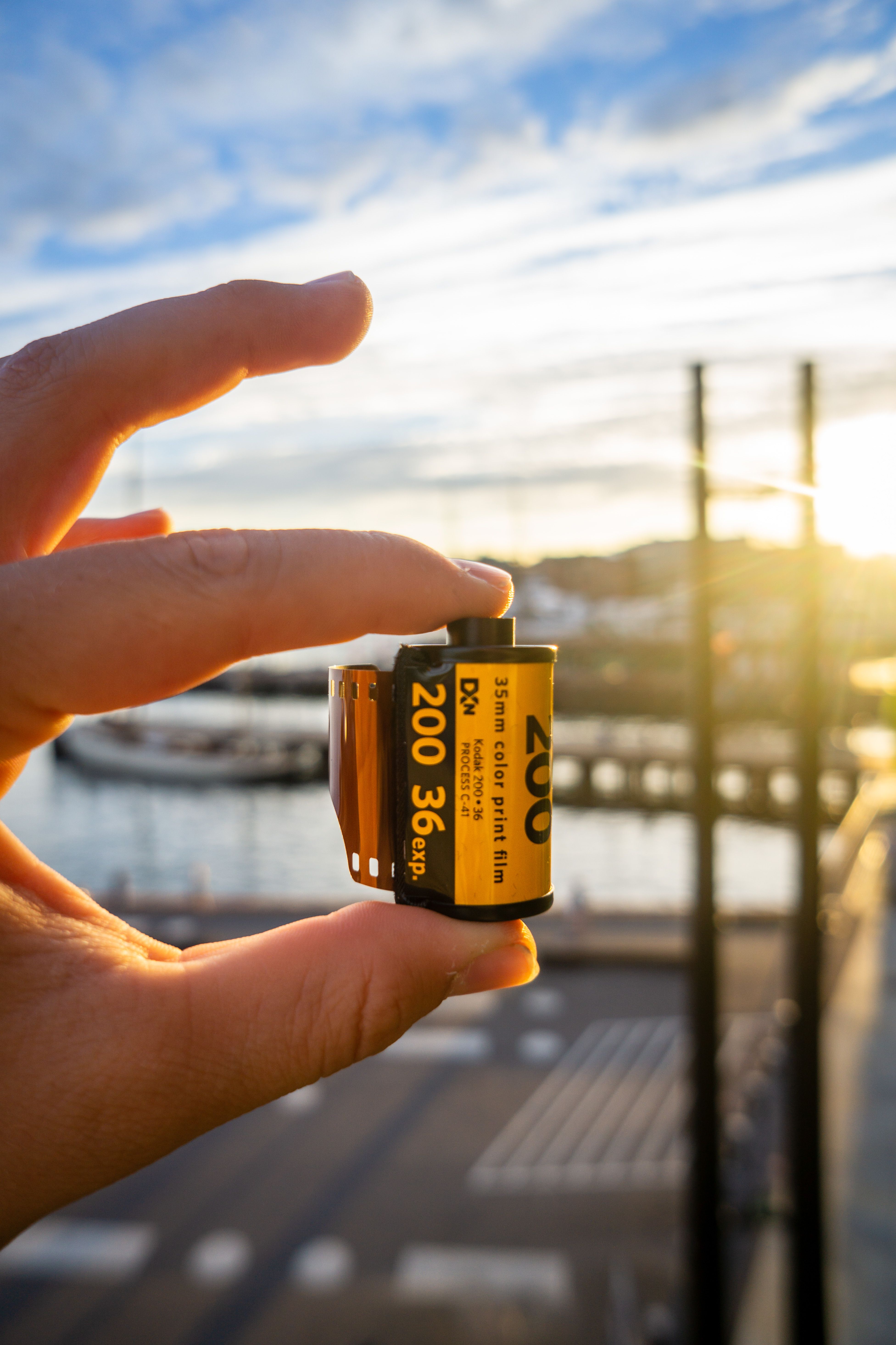Person Holding a Camera Film · Free Stock Photo