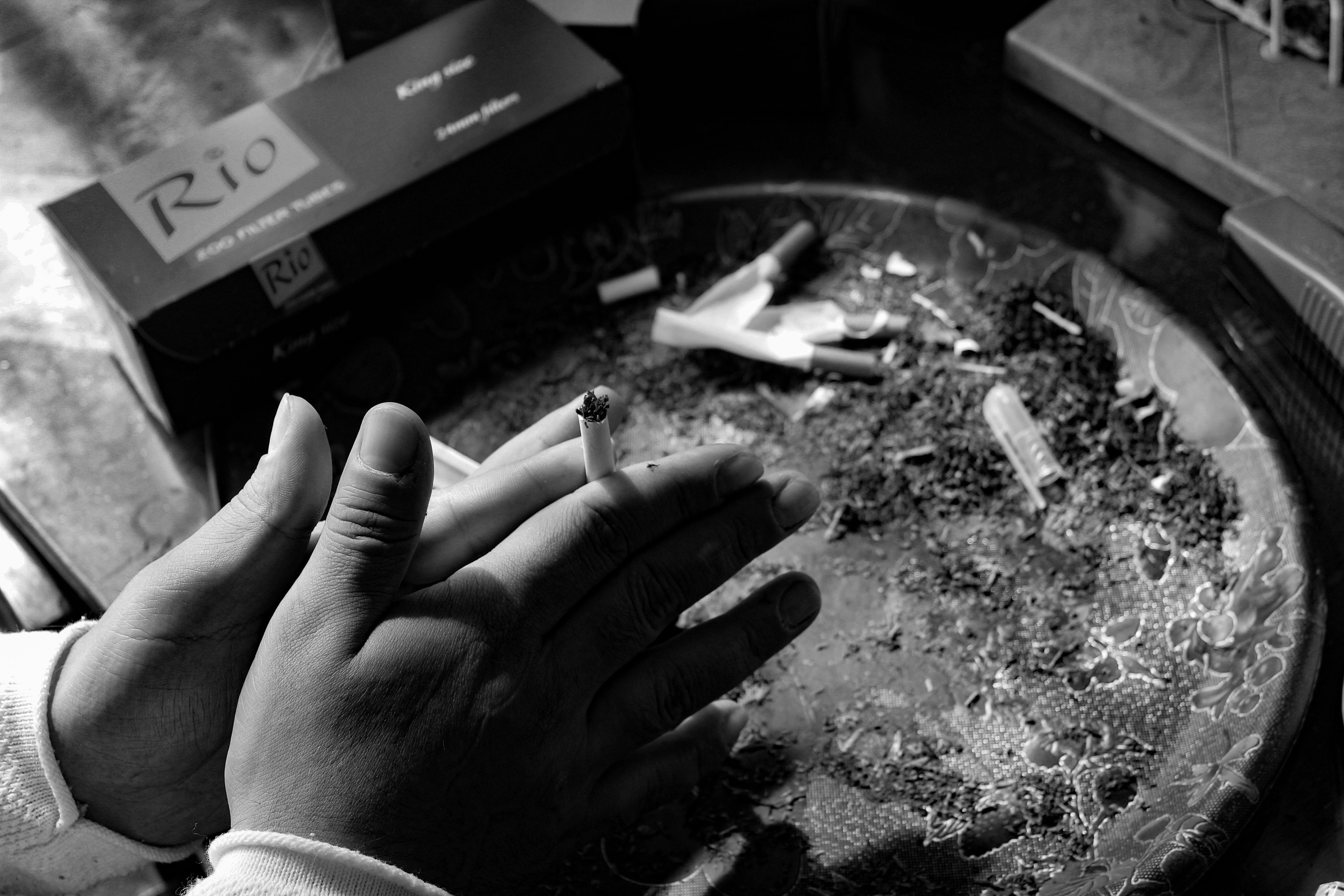 Hand Holding Decorated Lighter · Free Stock Photo