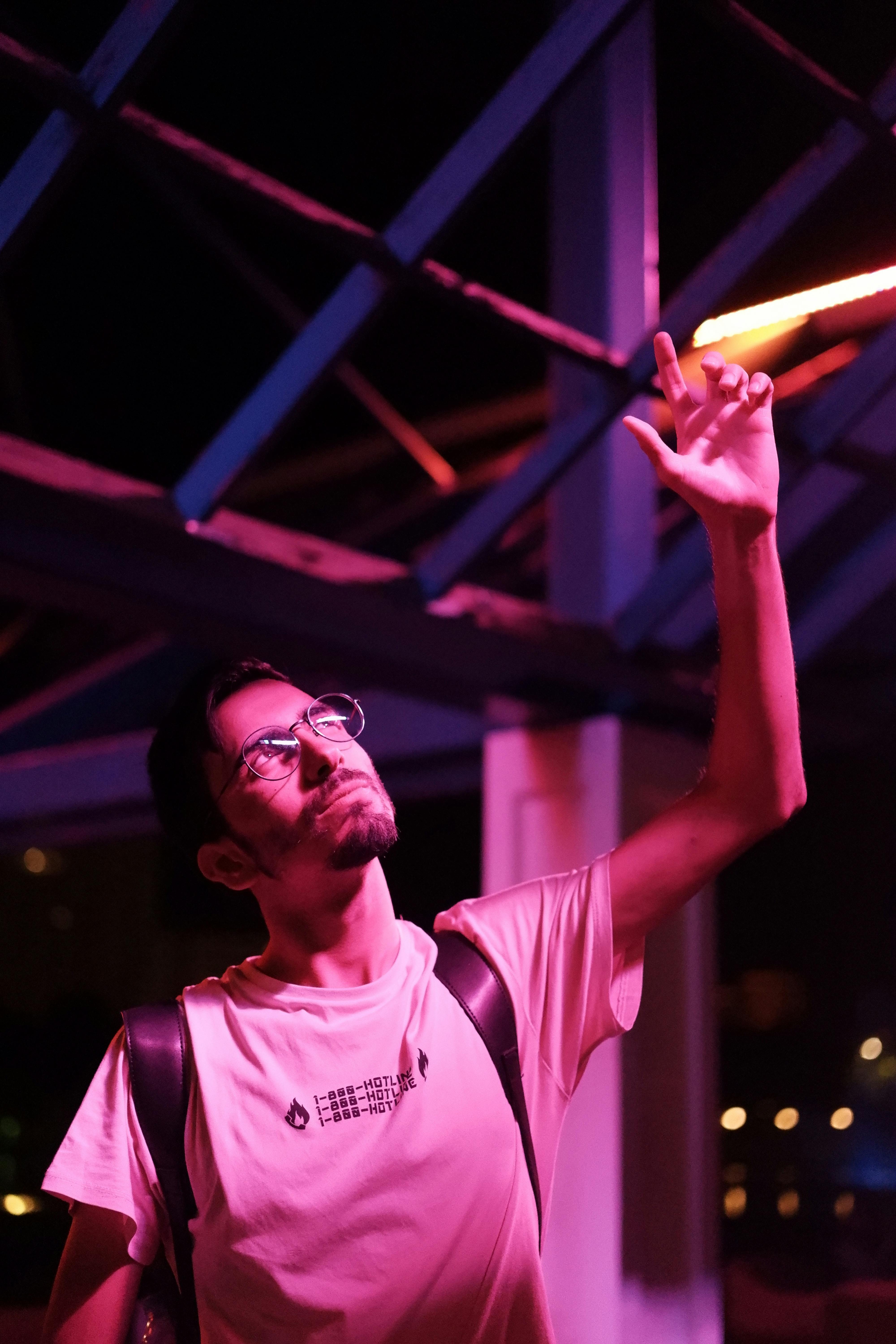 Man Raising His Right Arm · Free Stock Photo