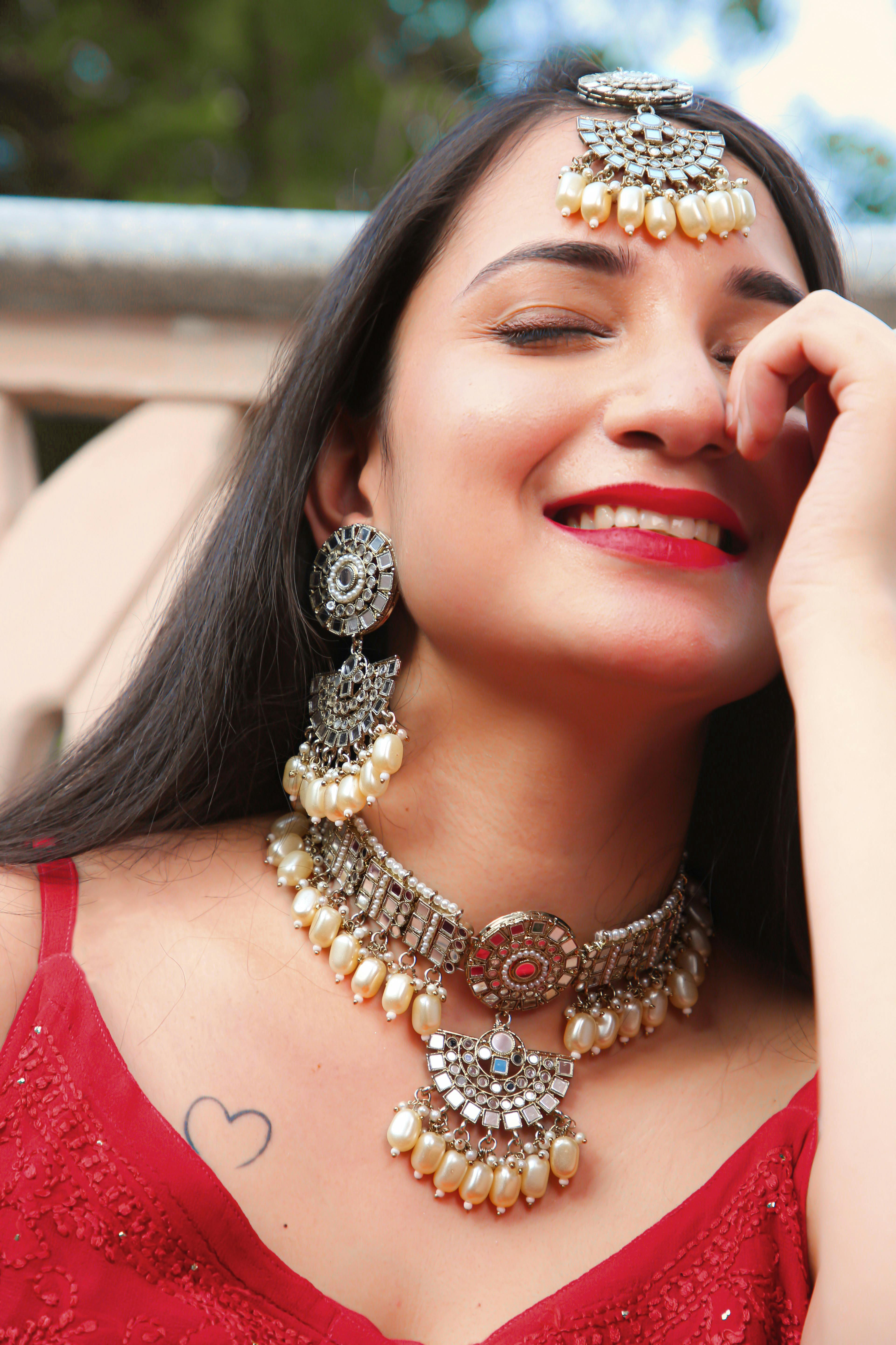 Woman Wearing Silver Jewelries · Free Stock Photo