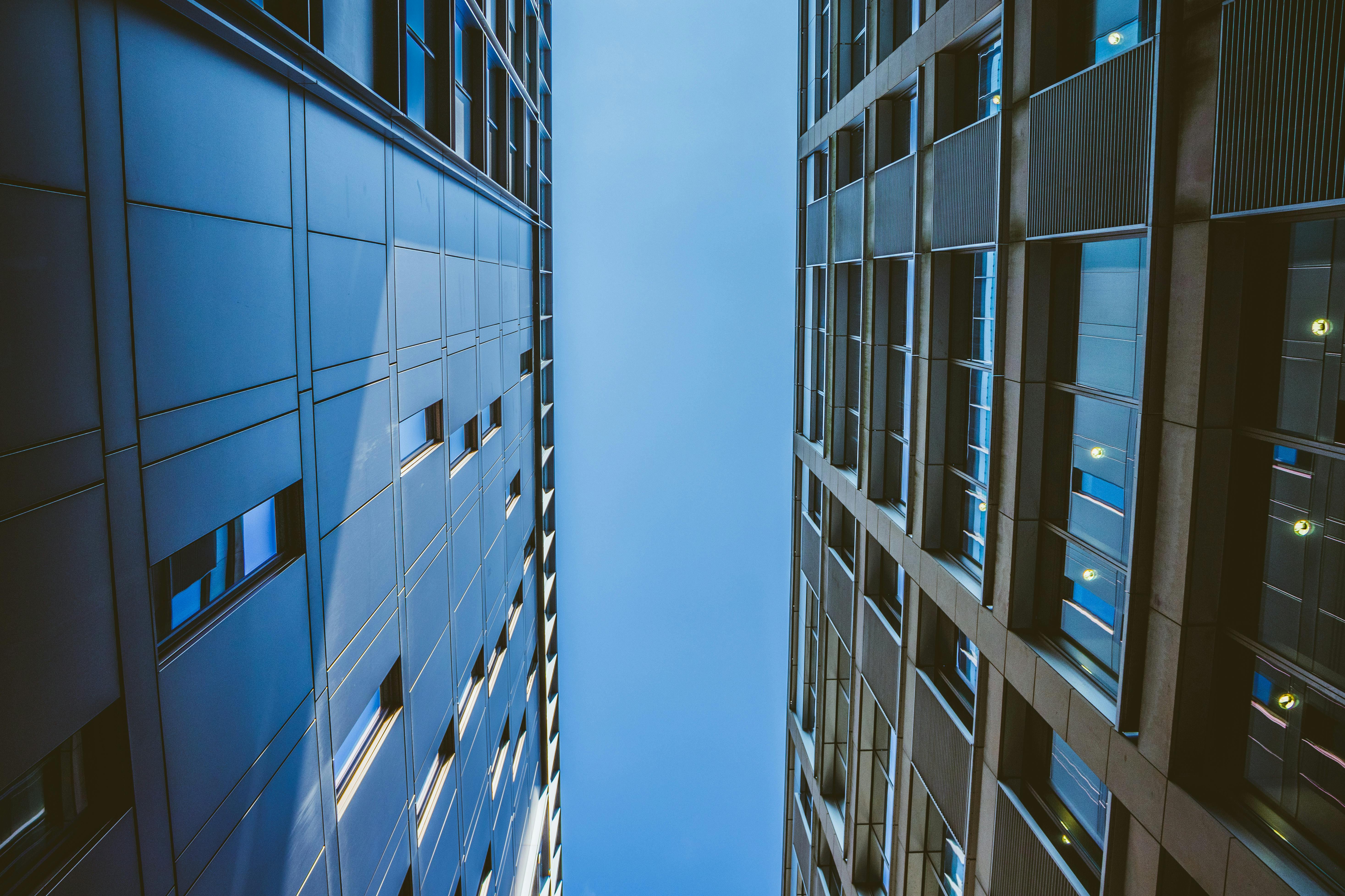 Clear Blue Sky over Buildings · Free Stock Photo