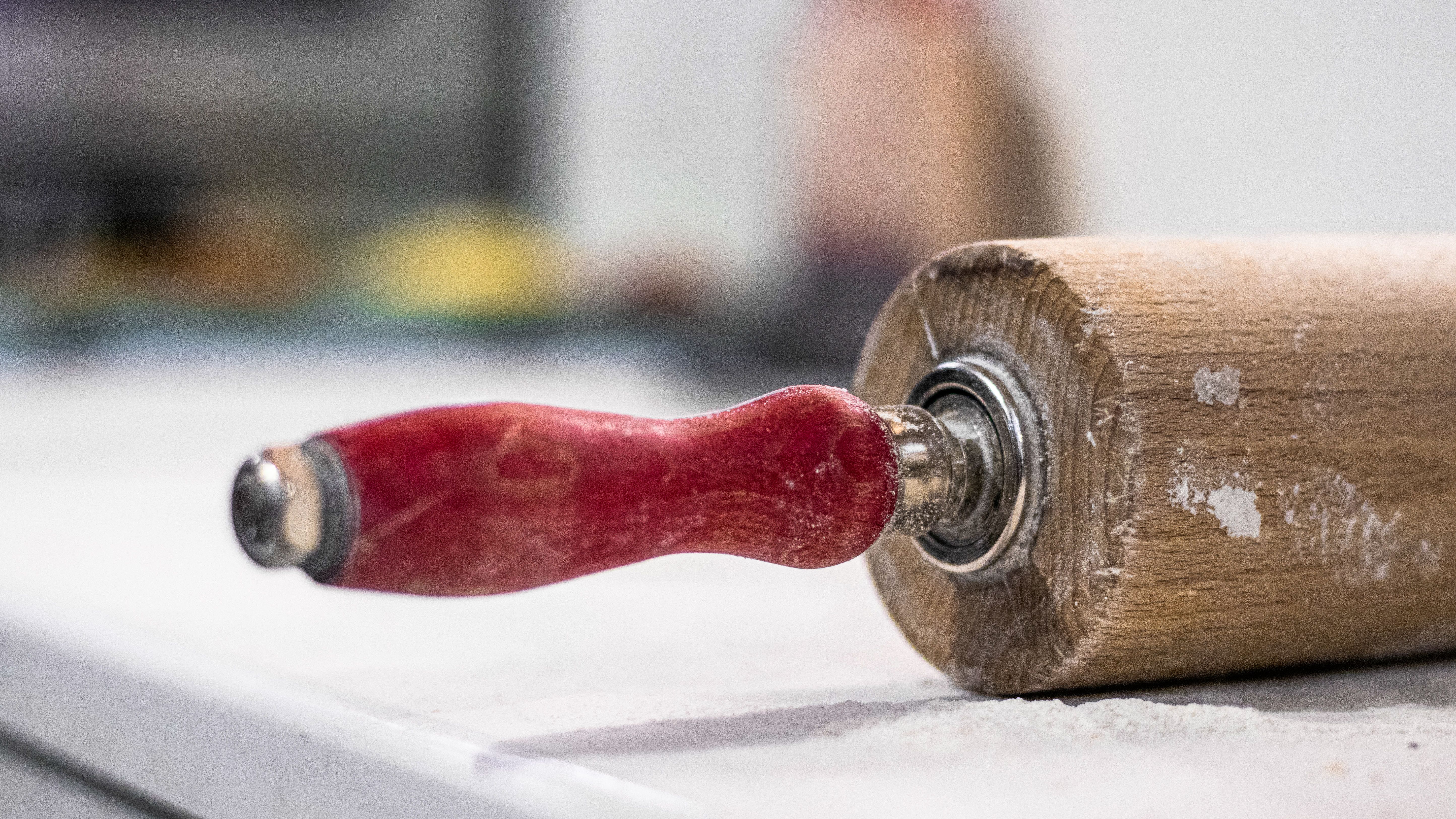 Close-Up Shot of a Rolling Pin on White Surface · Free Stock Photo