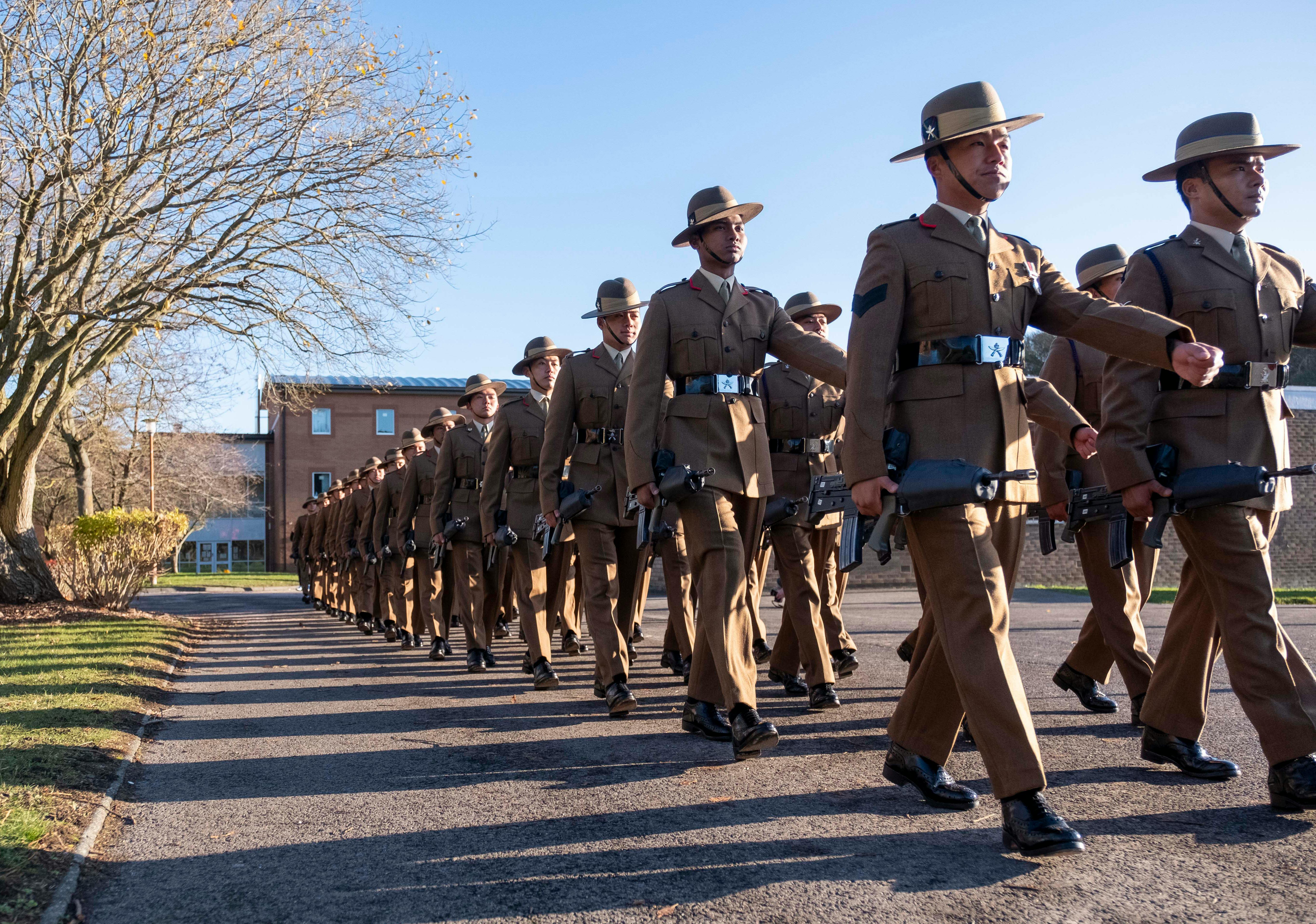Soldiers Marching with Machine Guns · Free Stock Photo