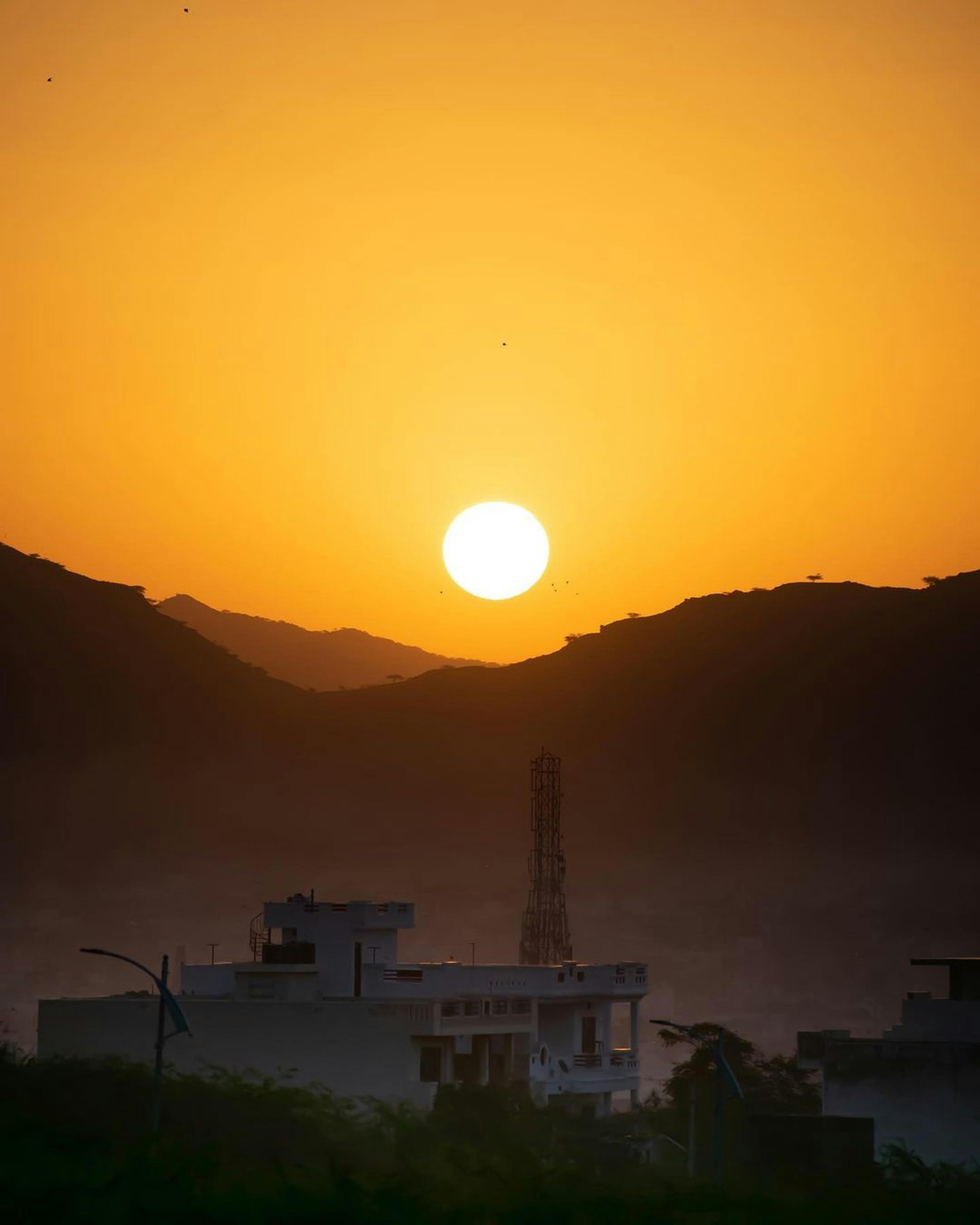 The Sun Setting Over Mountains · Free Stock Photo