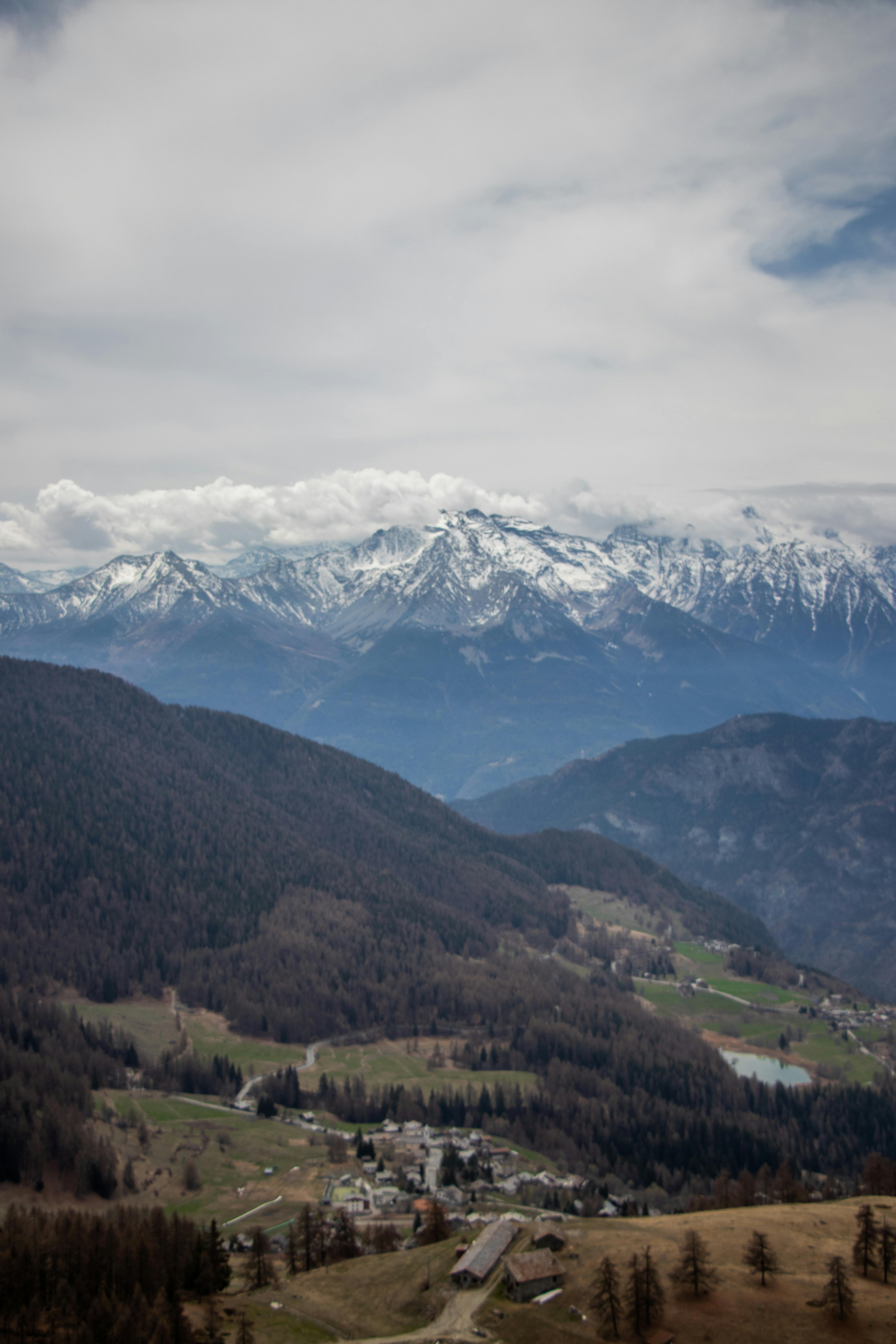 Aerial View of Buildings Near Mountains · Free Stock Photo