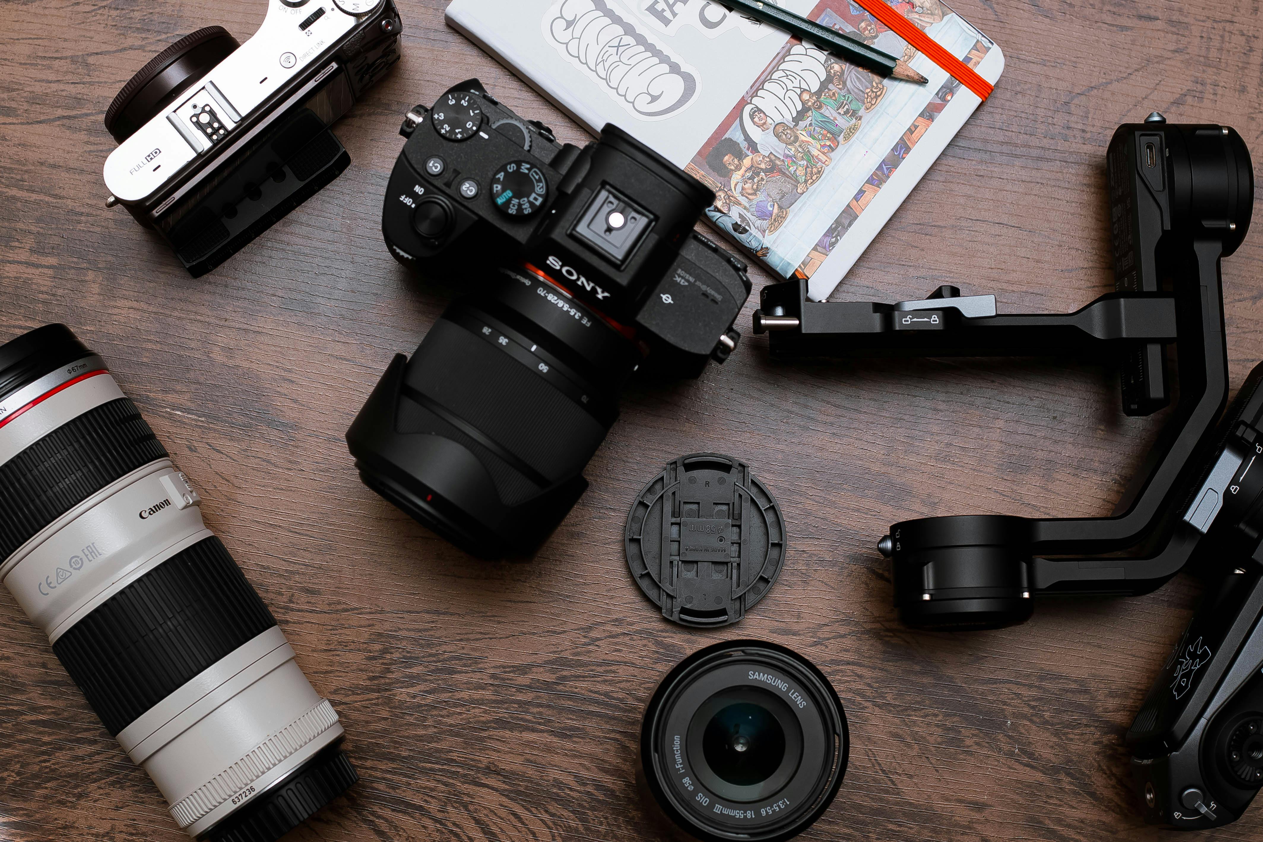 Professional Camera Lying next to Lenses and Clamp · Free Stock Photo