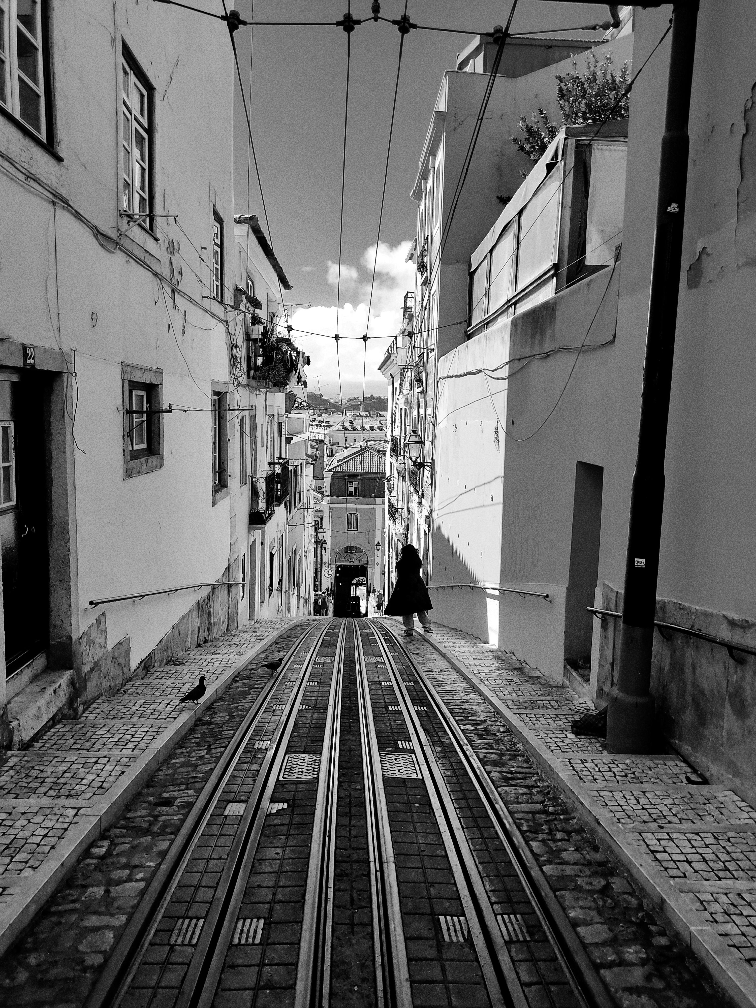 A Grayscale of Tram Lines in a City · Free Stock Photo