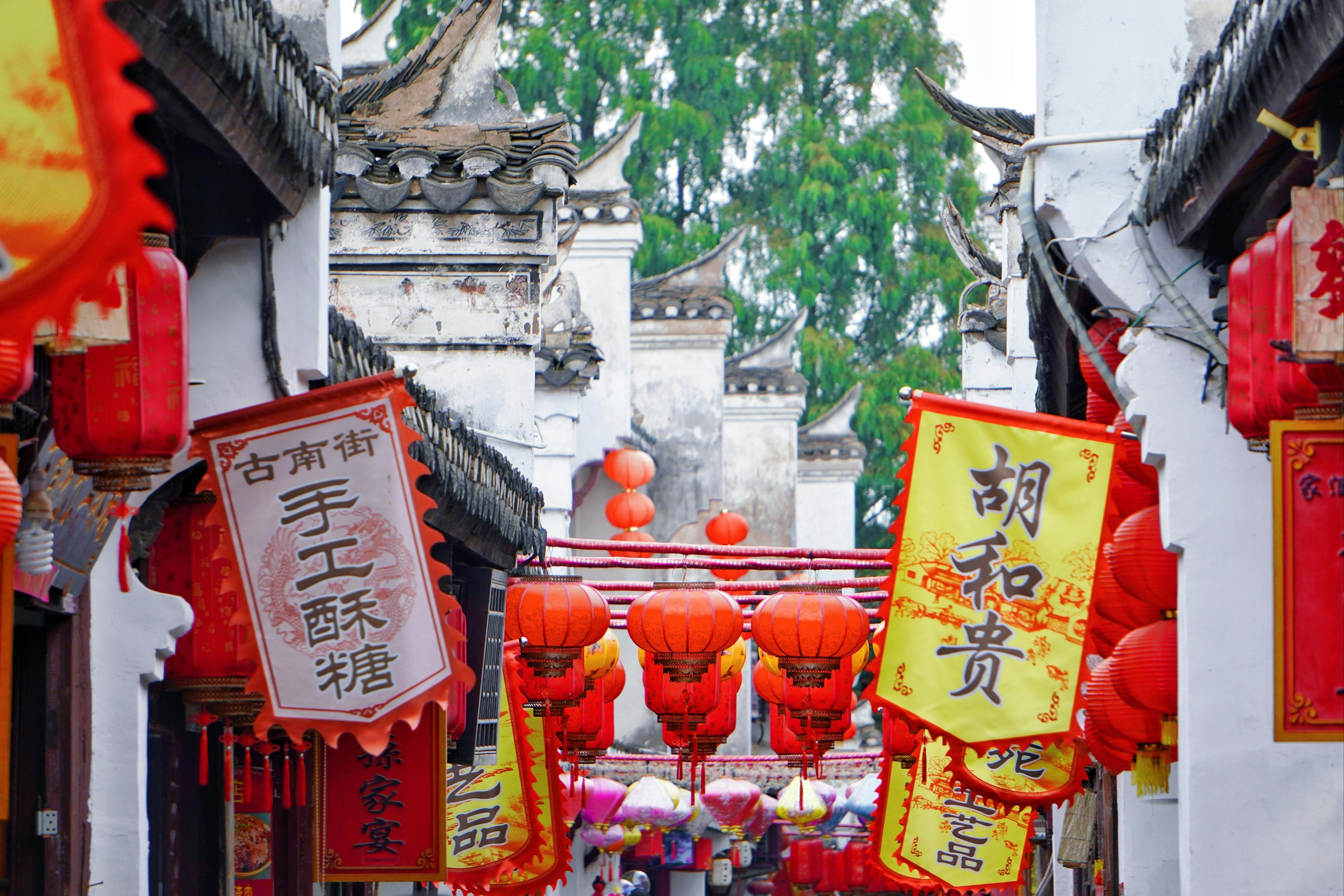 Man on a City Street in Front of an Entrance with Traditional Chinese ...