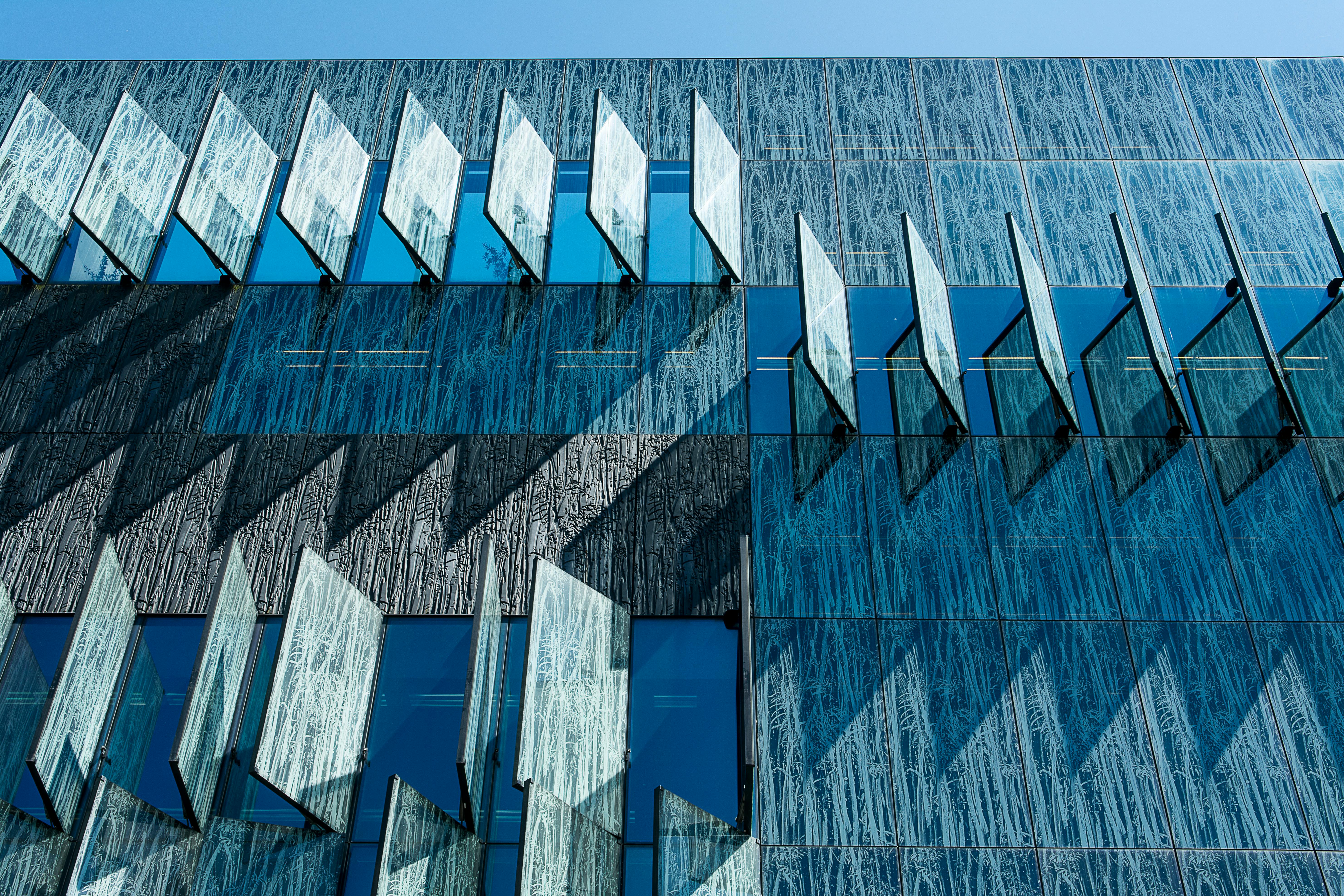 Modern Glass Building Facade with Windows · Free Stock Photo