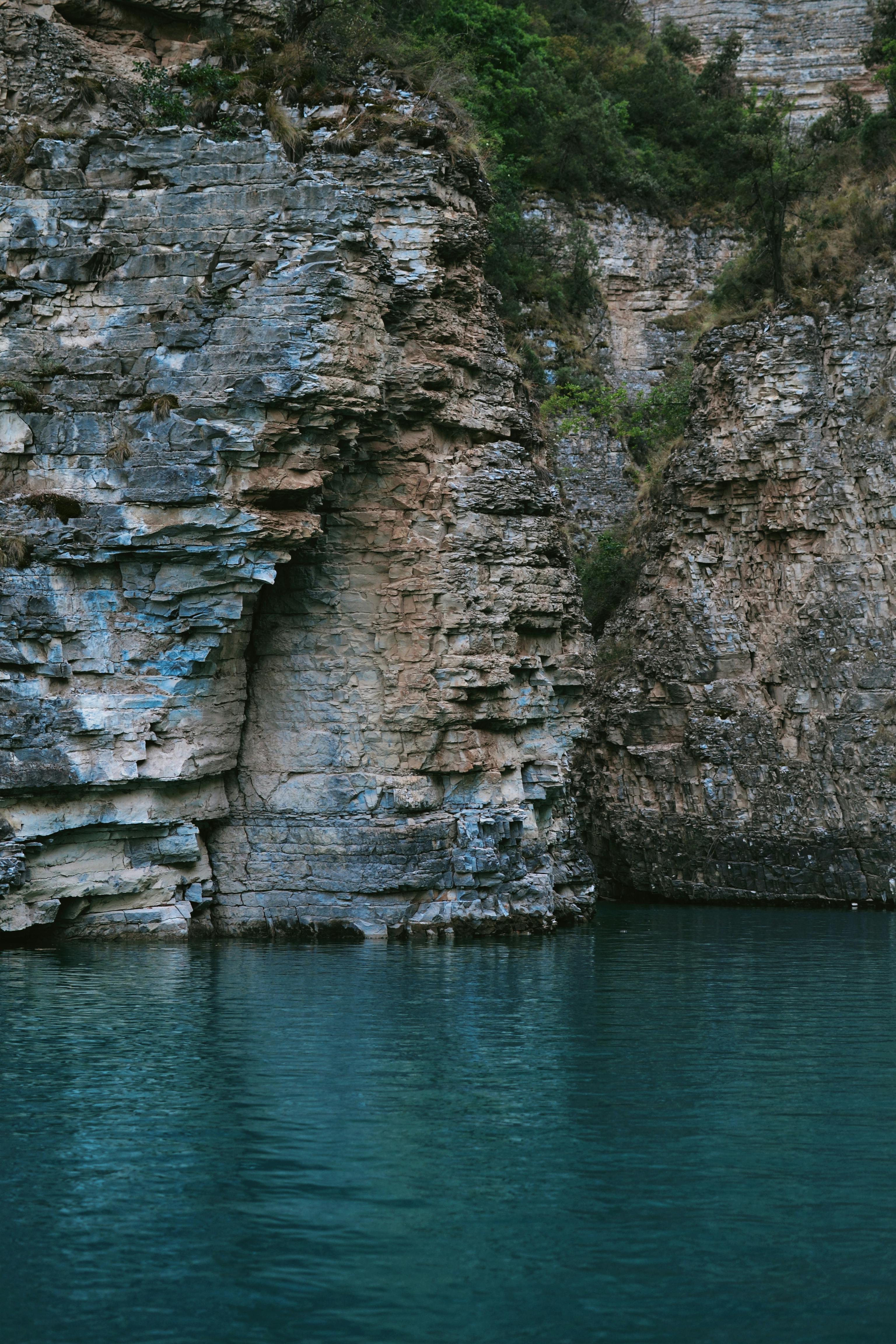 Rocks Cliff at the Water · Free Stock Photo