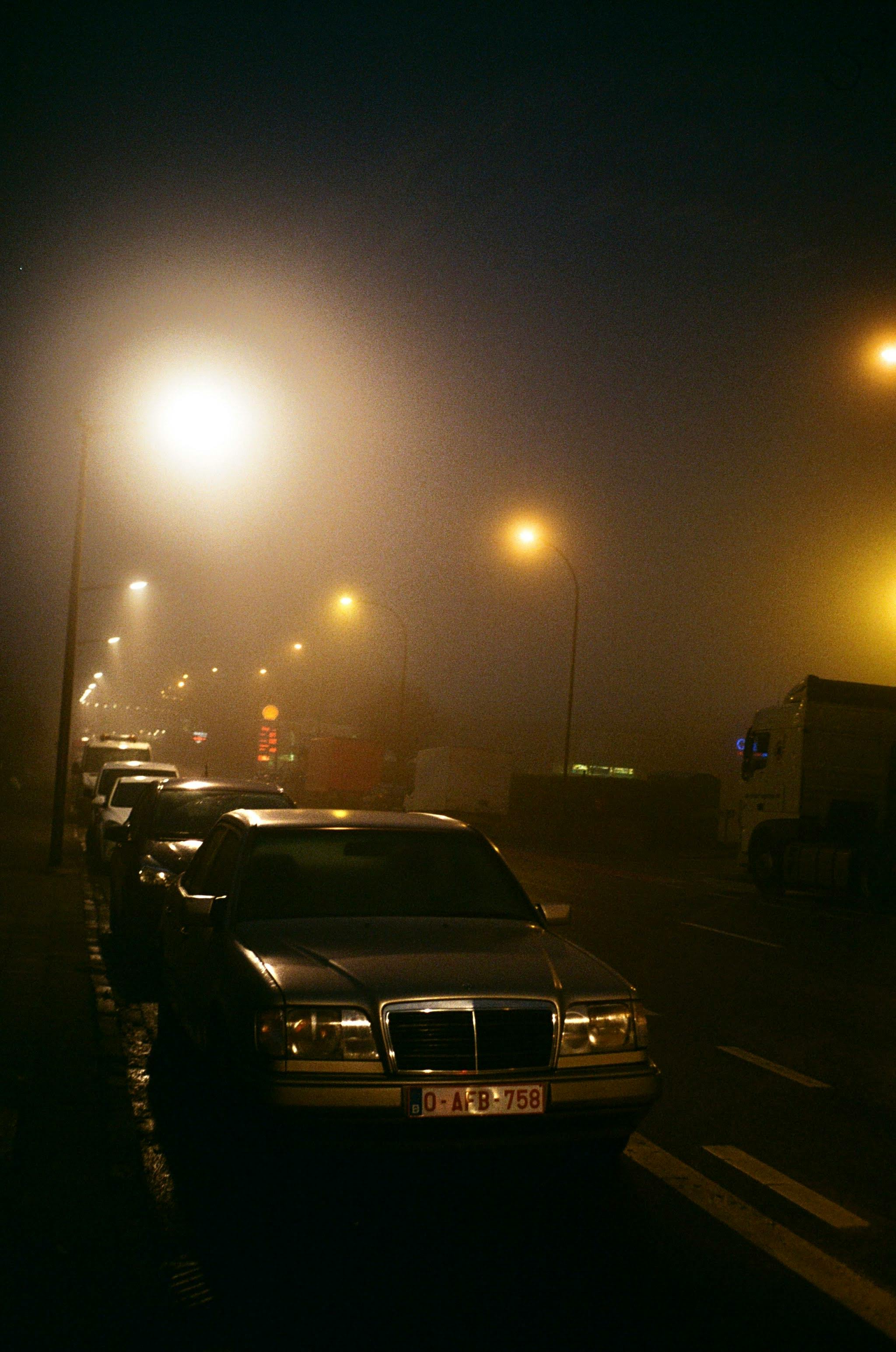 Cars Parked on Side Street during Night Time · Free Stock Photo