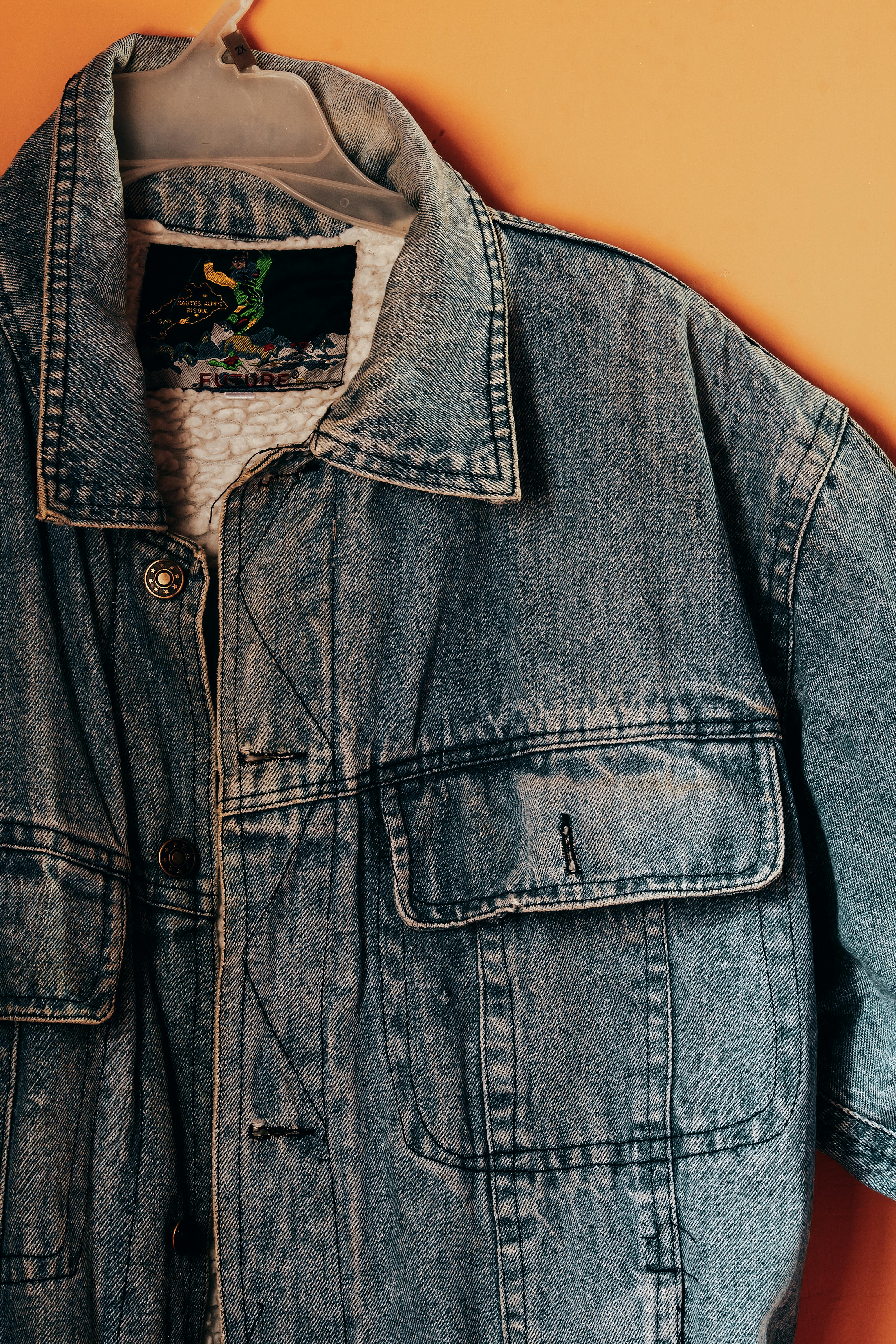 Blue Denim Jacket Hanging on the Wall · Free Stock Photo