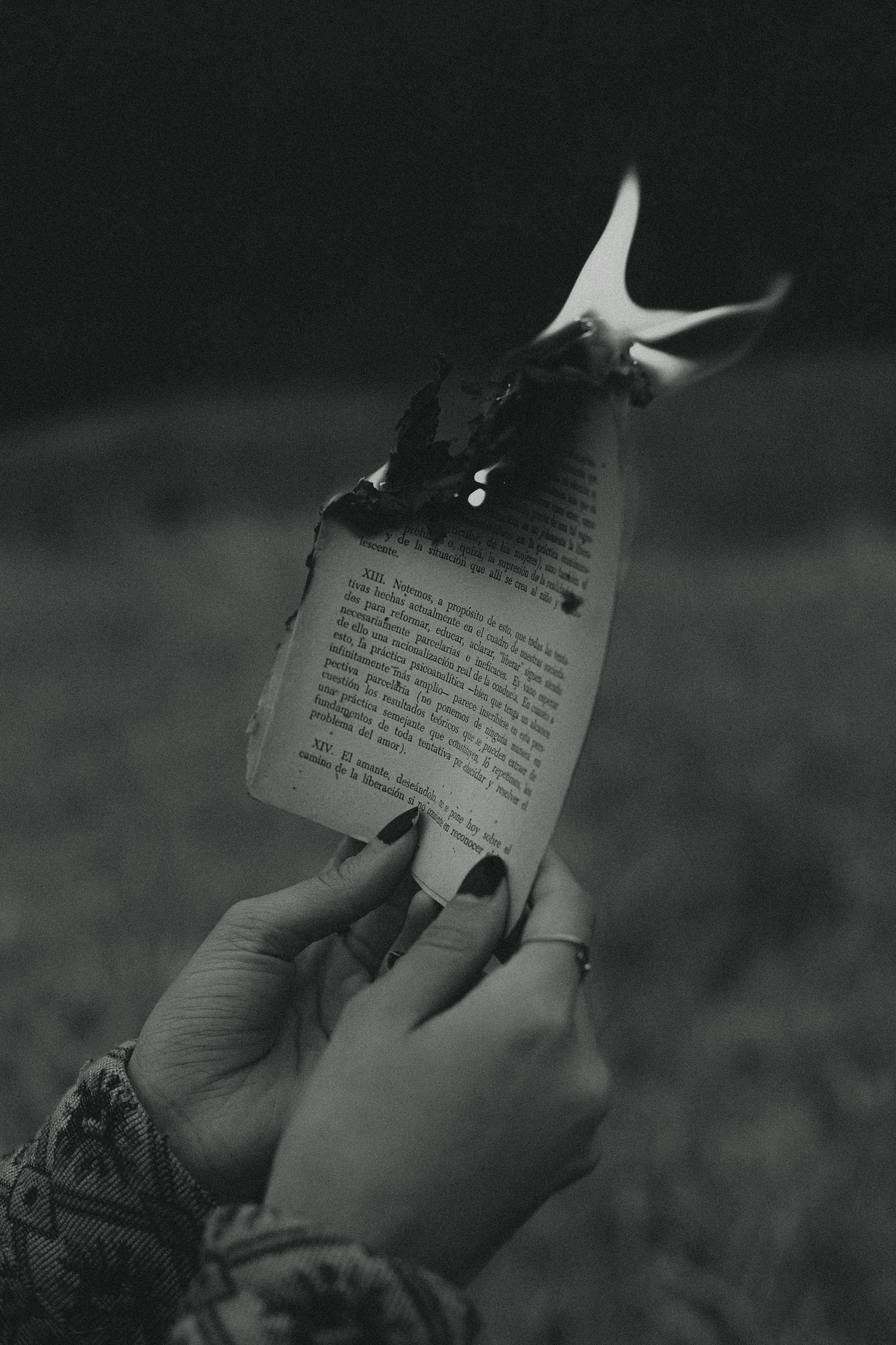 Hands Holding Burning Page of Book · Free Stock Photo