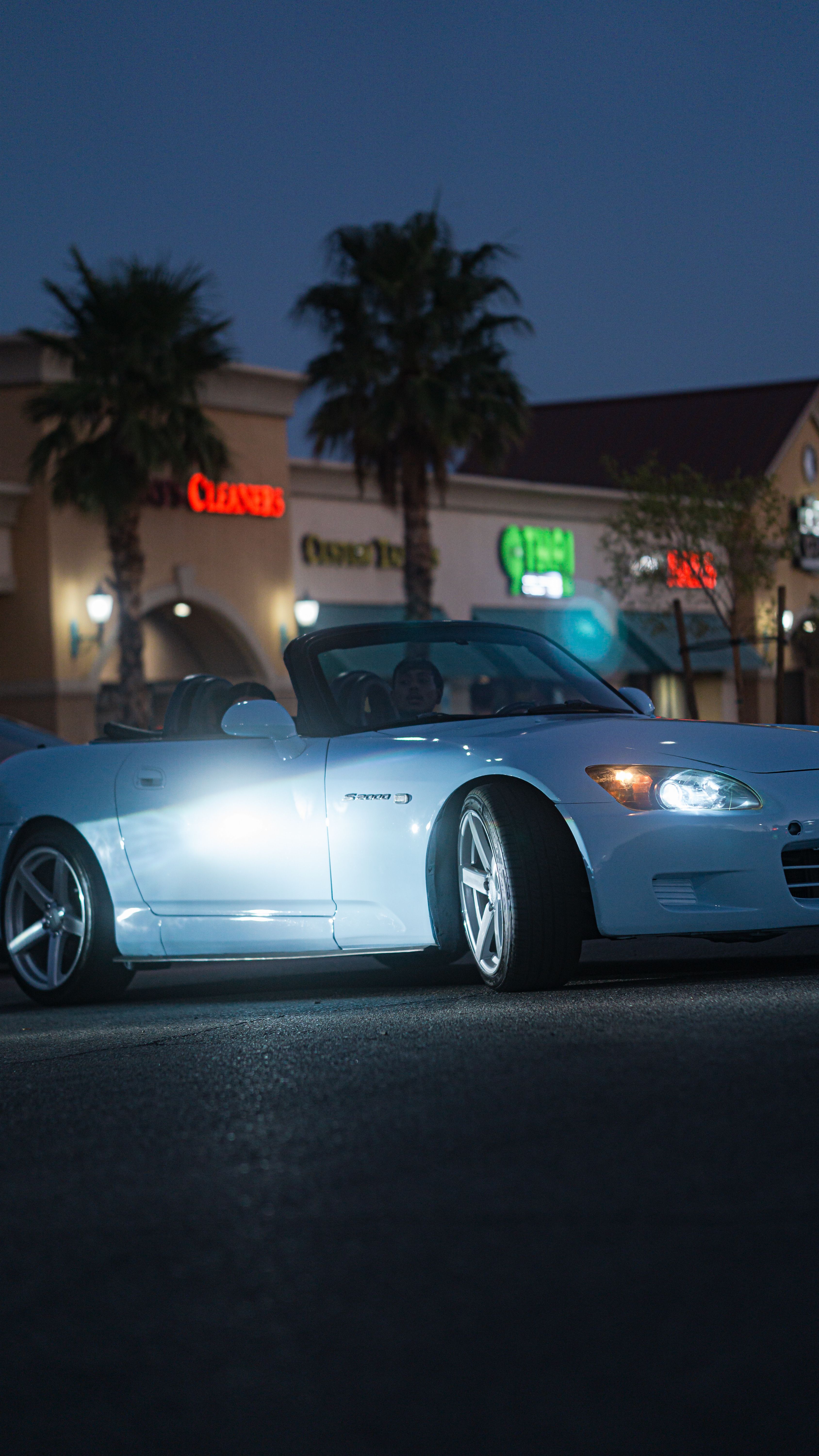 A White Car on the Road at Night · Free Stock Photo