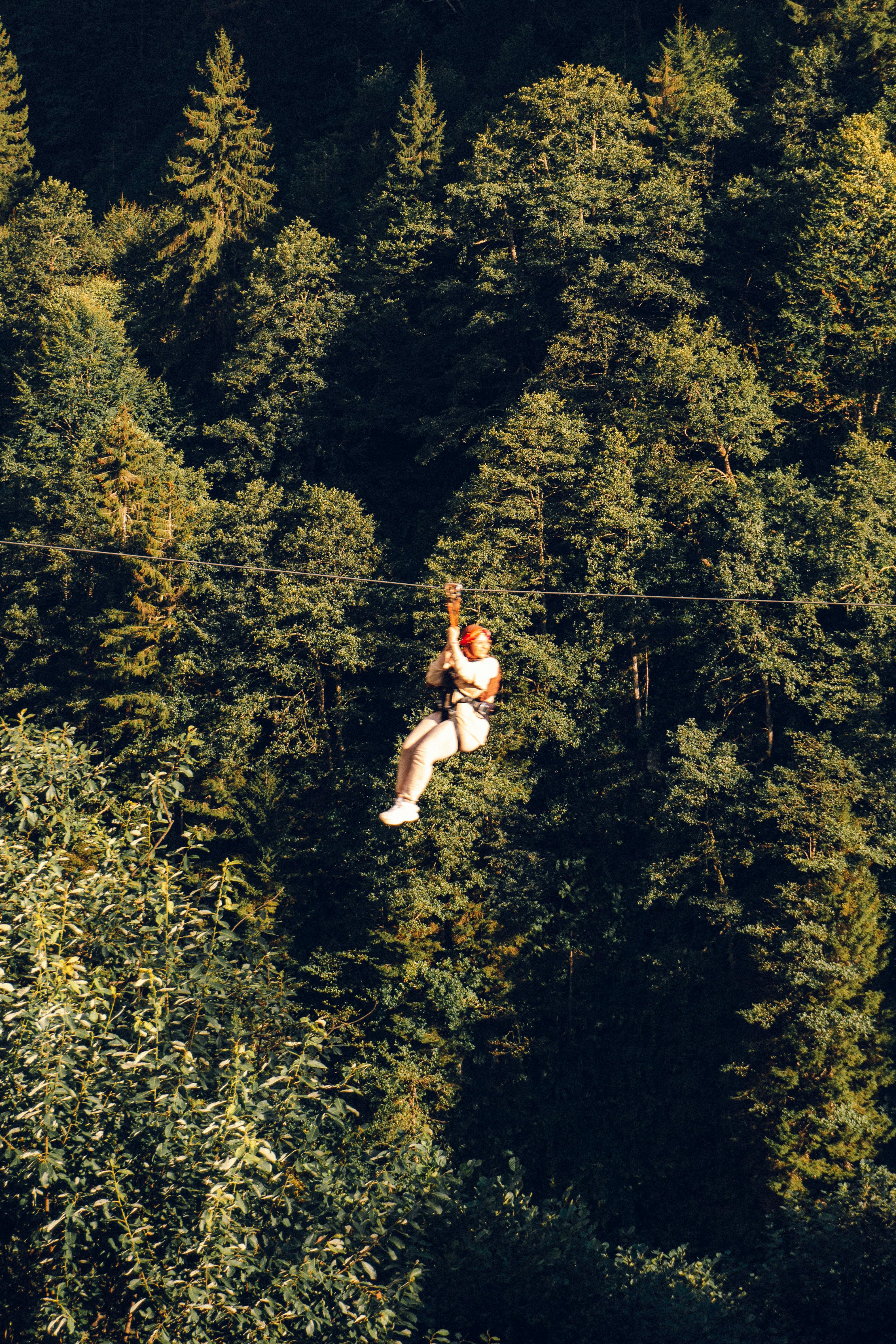 A Person Riding a Zip Line · Free Stock Photo