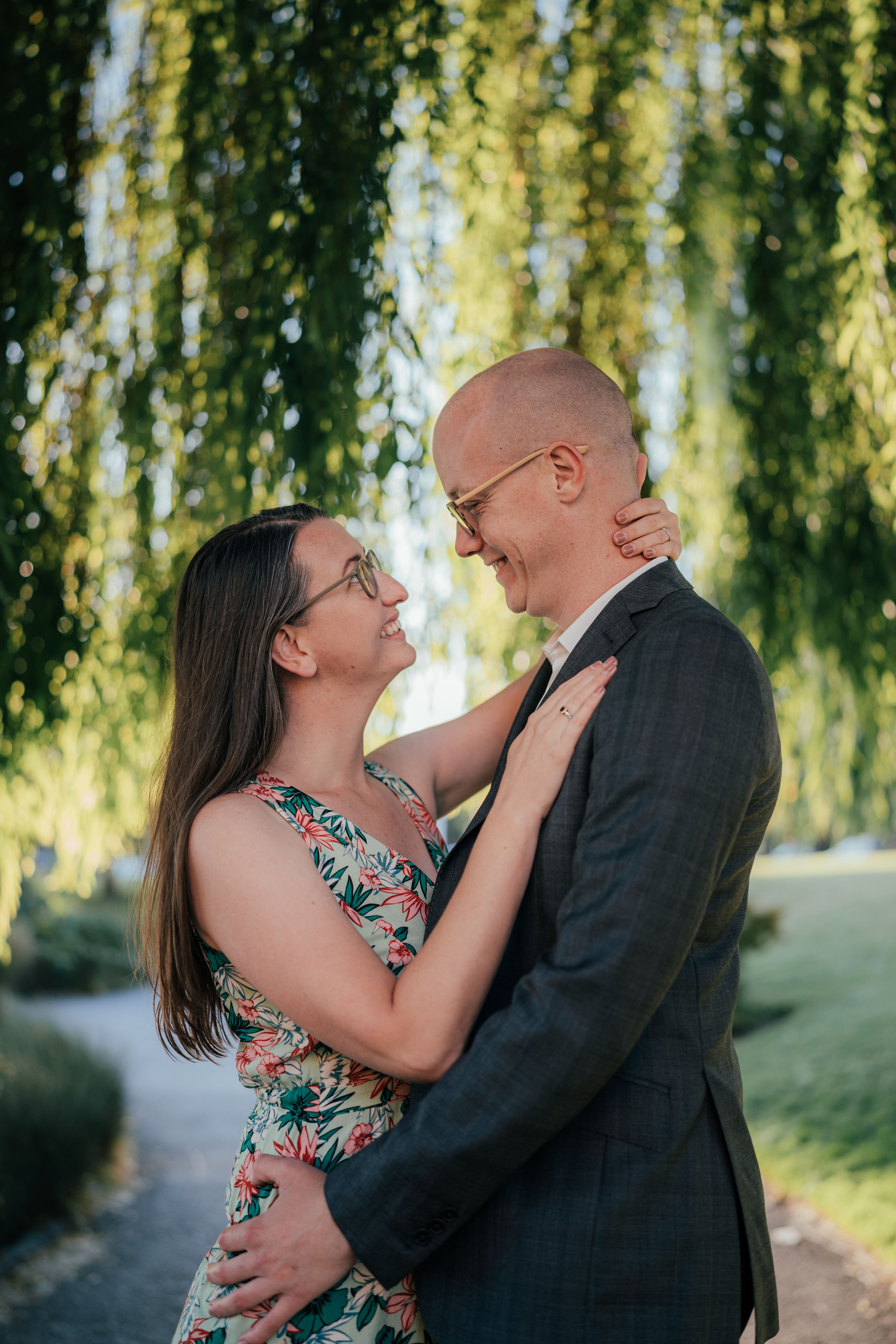 A Couple Hugging Near Green Trees · Free Stock Photo