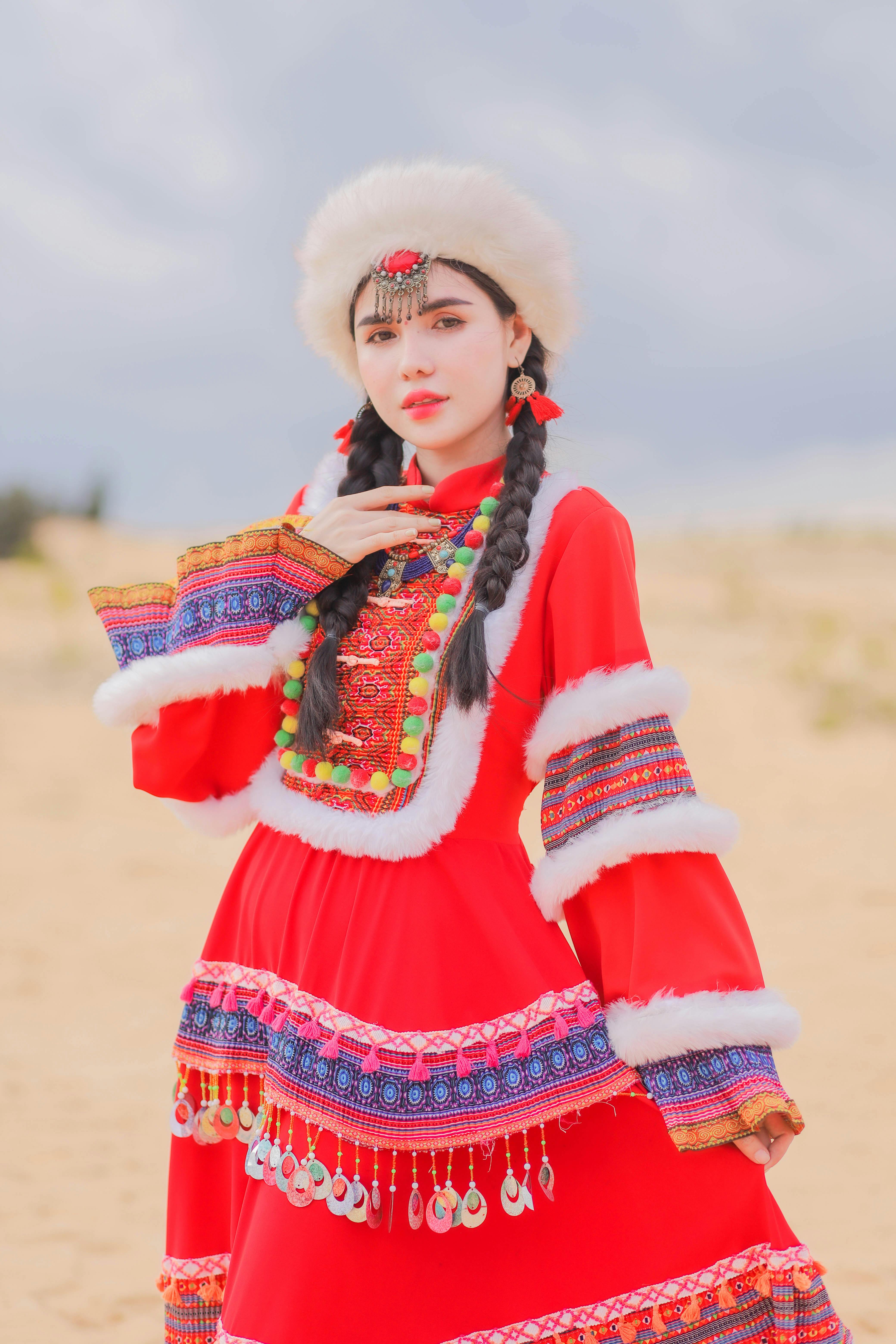 Person in Red, Traditional Clothing with Covered Head · Free Stock Photo