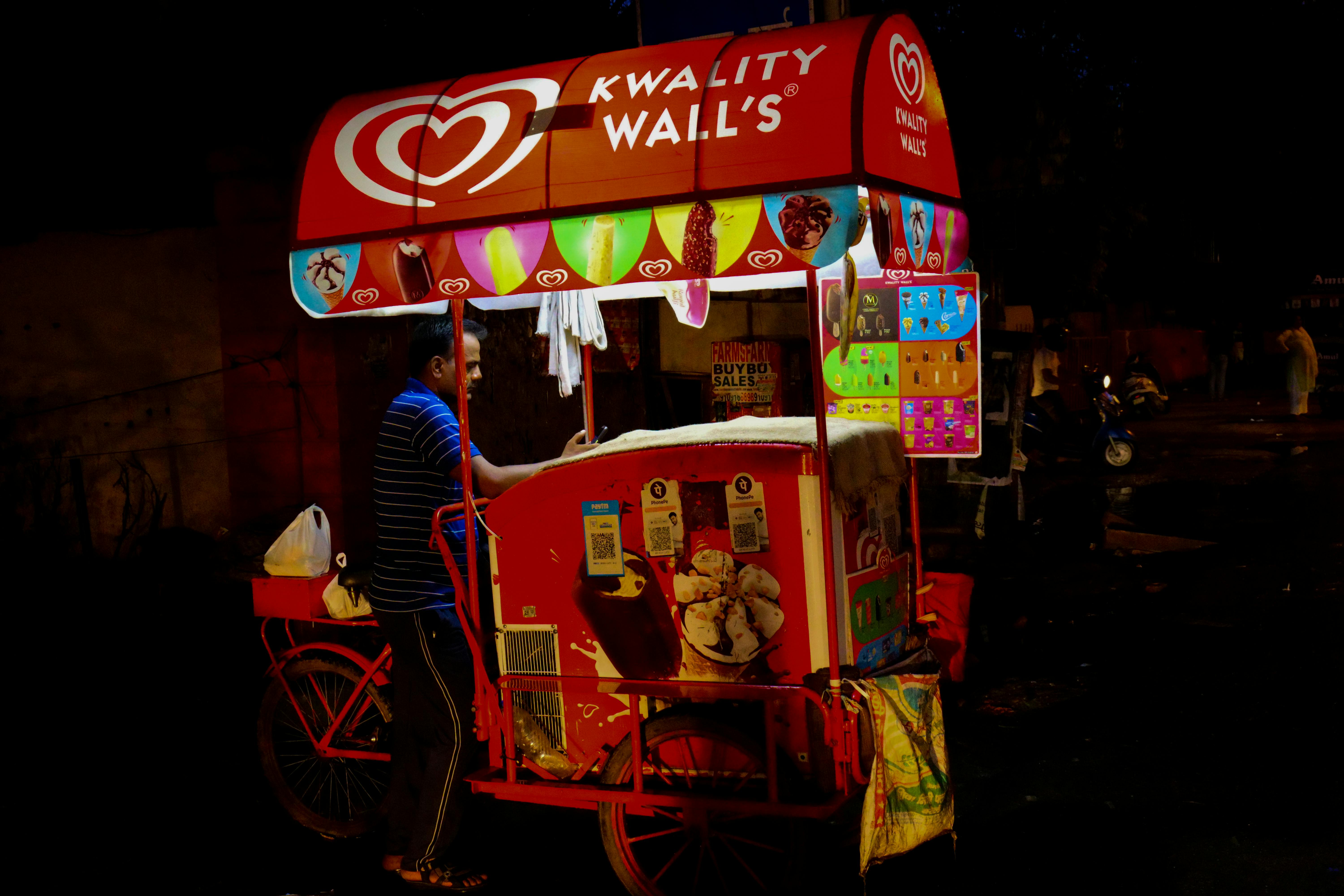 A Man Selling Ice Cream at Night · Free Stock Photo