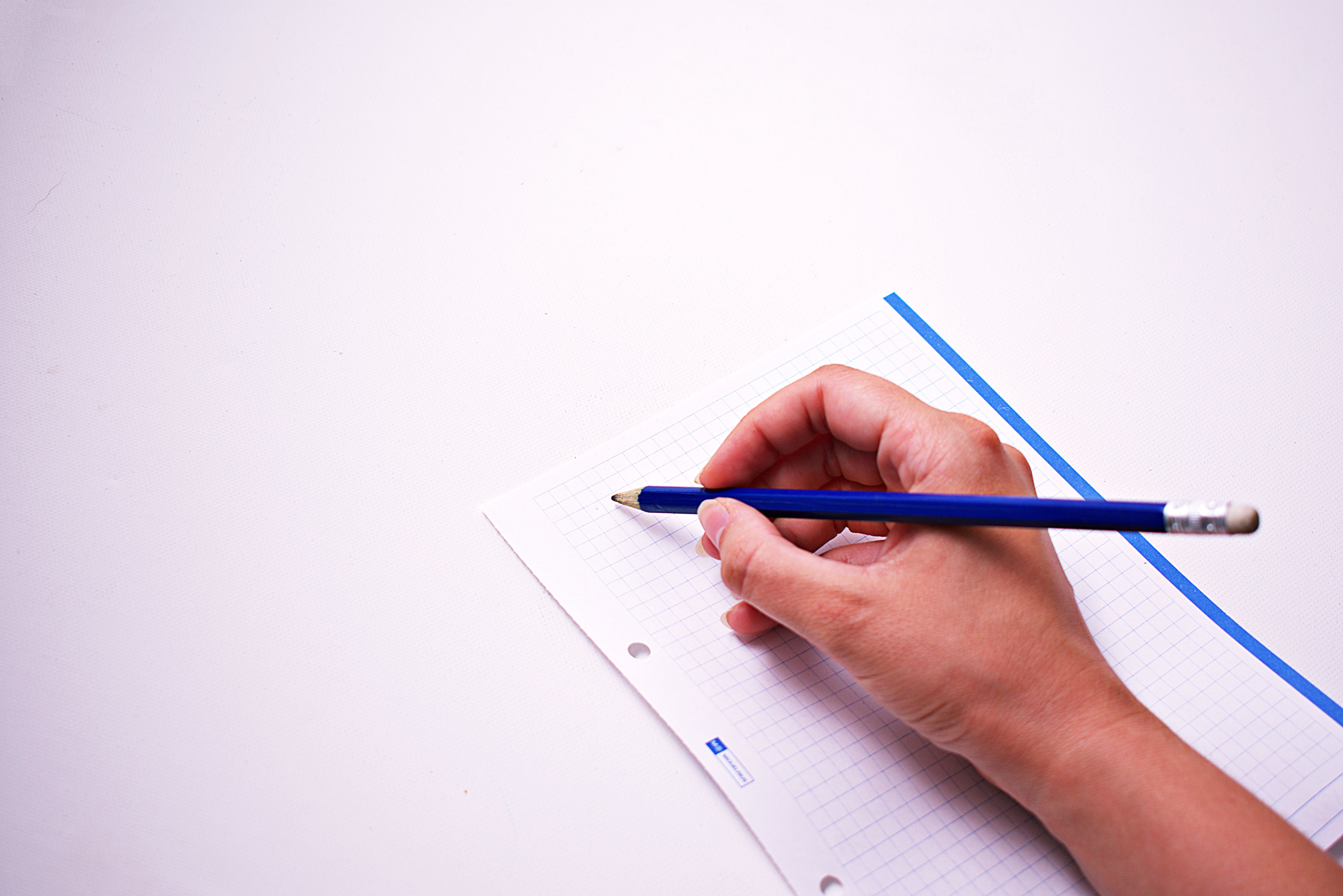 Person Writing On White Paper · Free Stock Photo