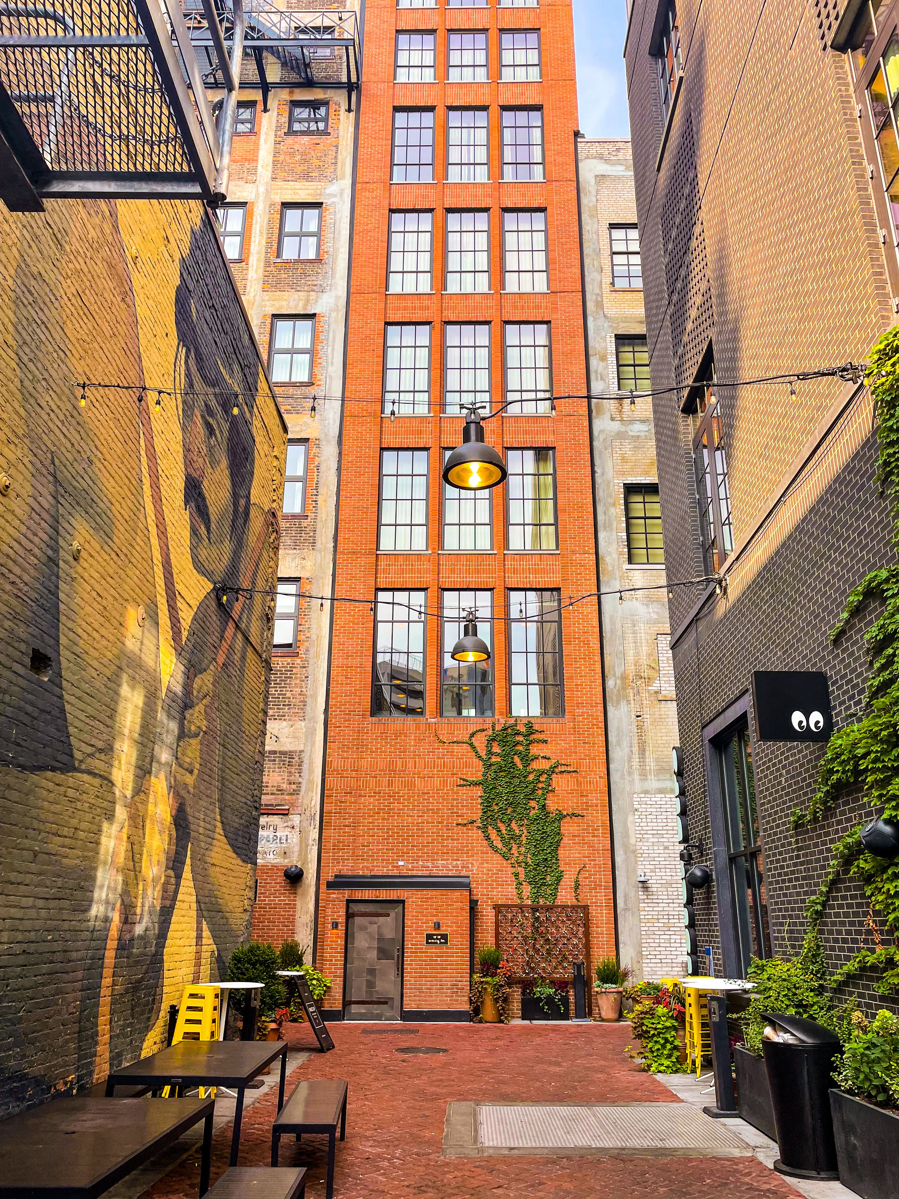 Tall Building with Windows at End of Alley · Free Stock Photo