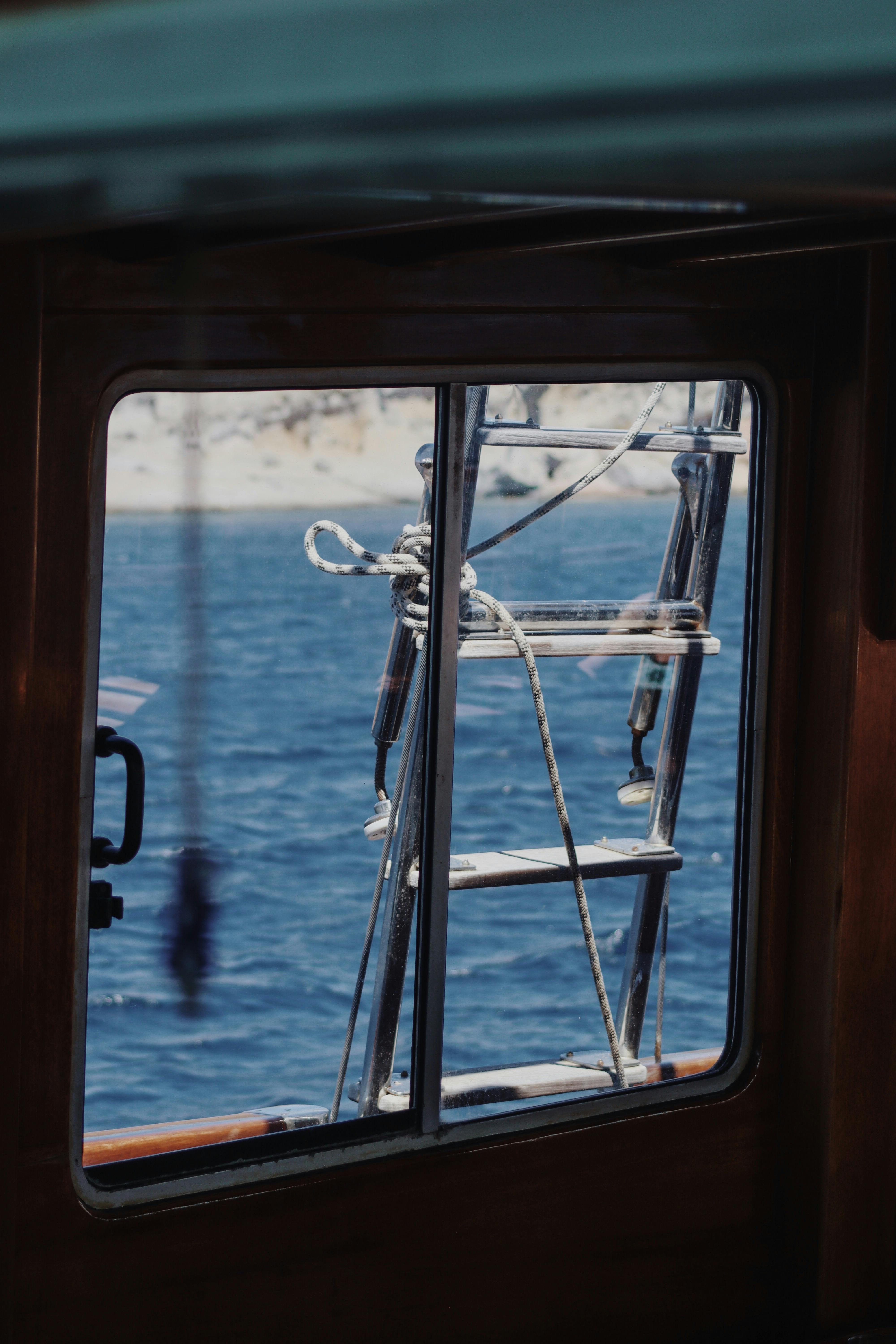Gray Ladder Beside the Glass Window · Free Stock Photo