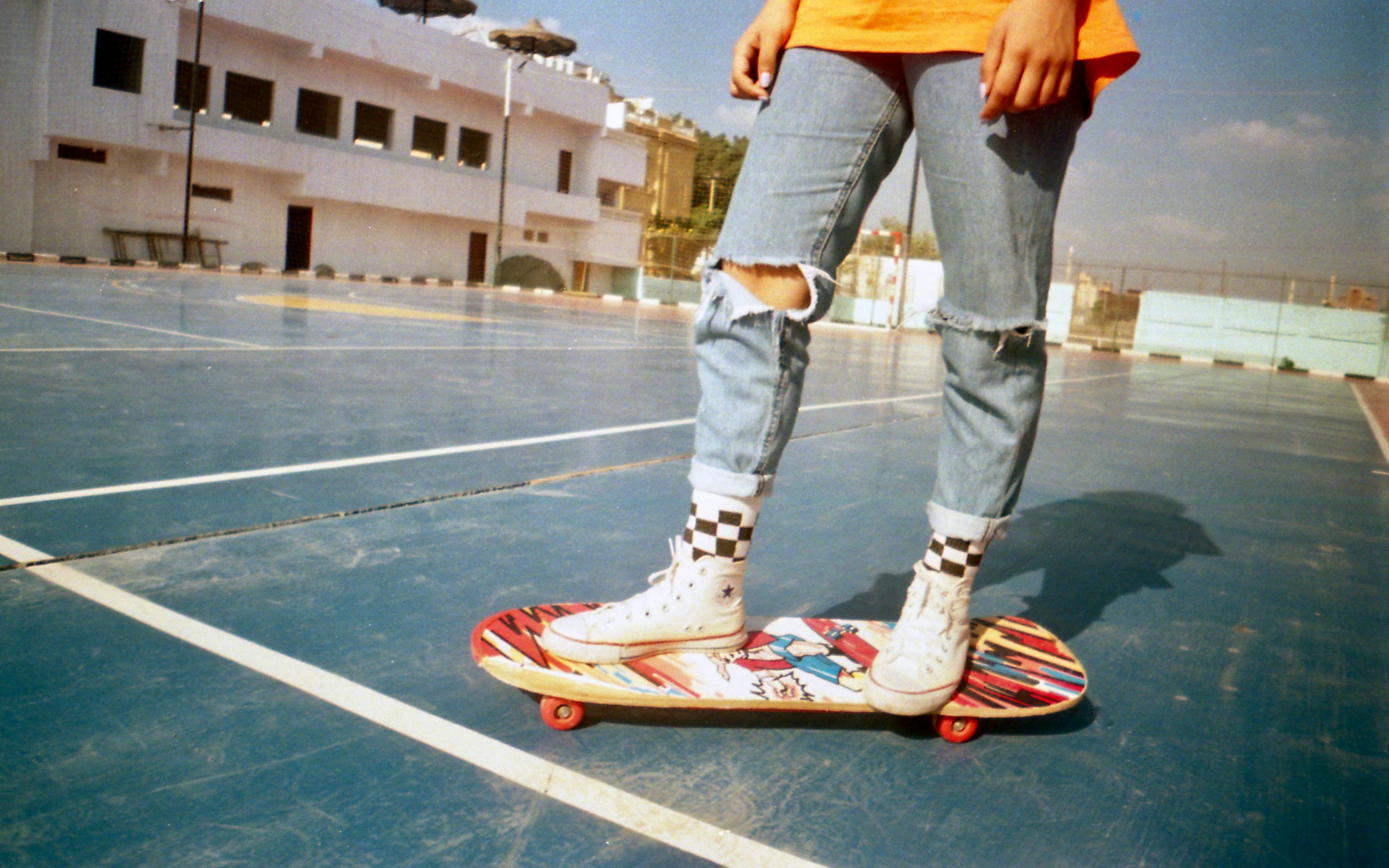 A Person Standing on a Skateboard · Free Stock Photo