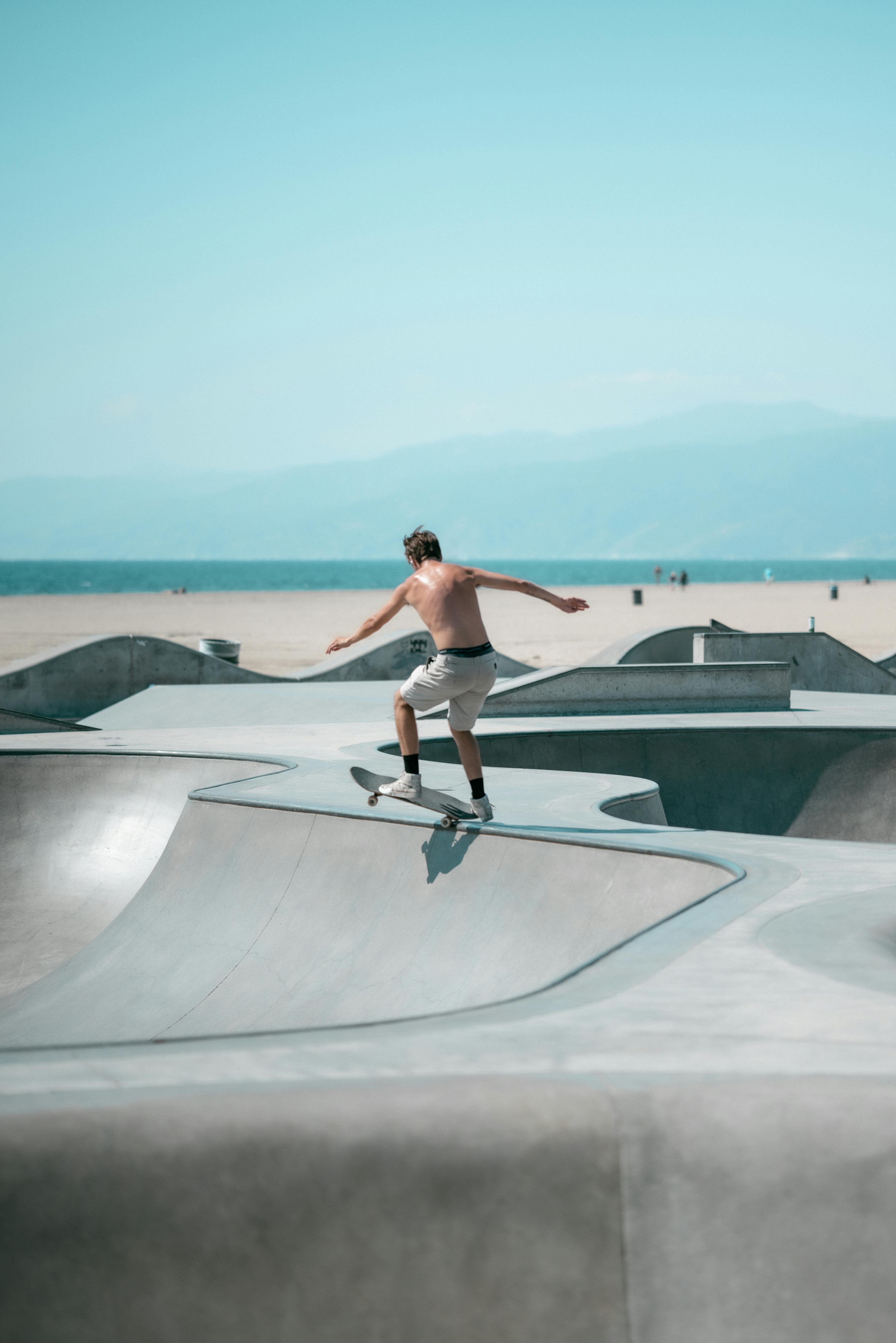 Shirtless Man Skateboarding at Skatepark · Free Stock Photo