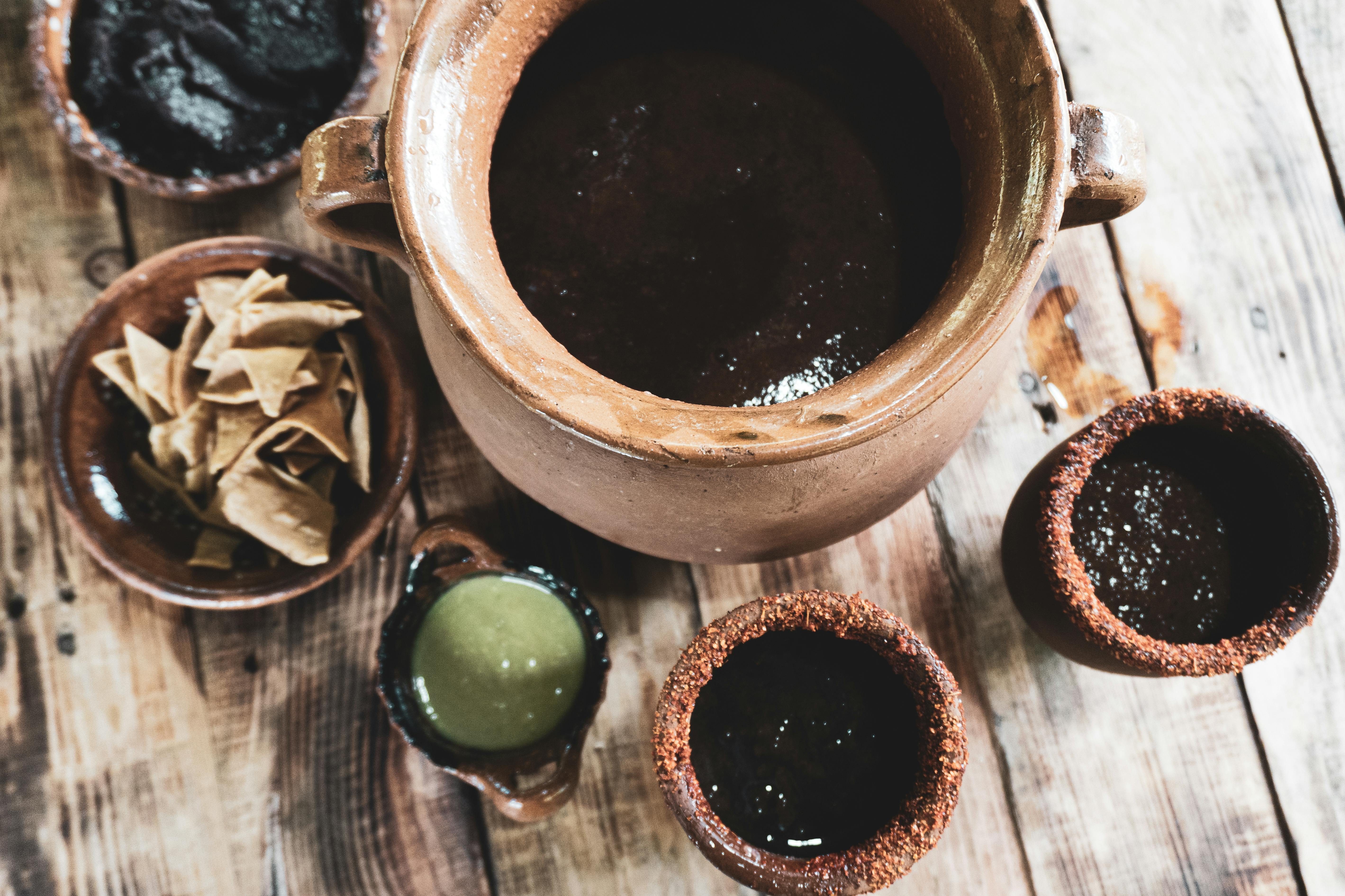 Dark Food in Brown Containers · Free Stock Photo