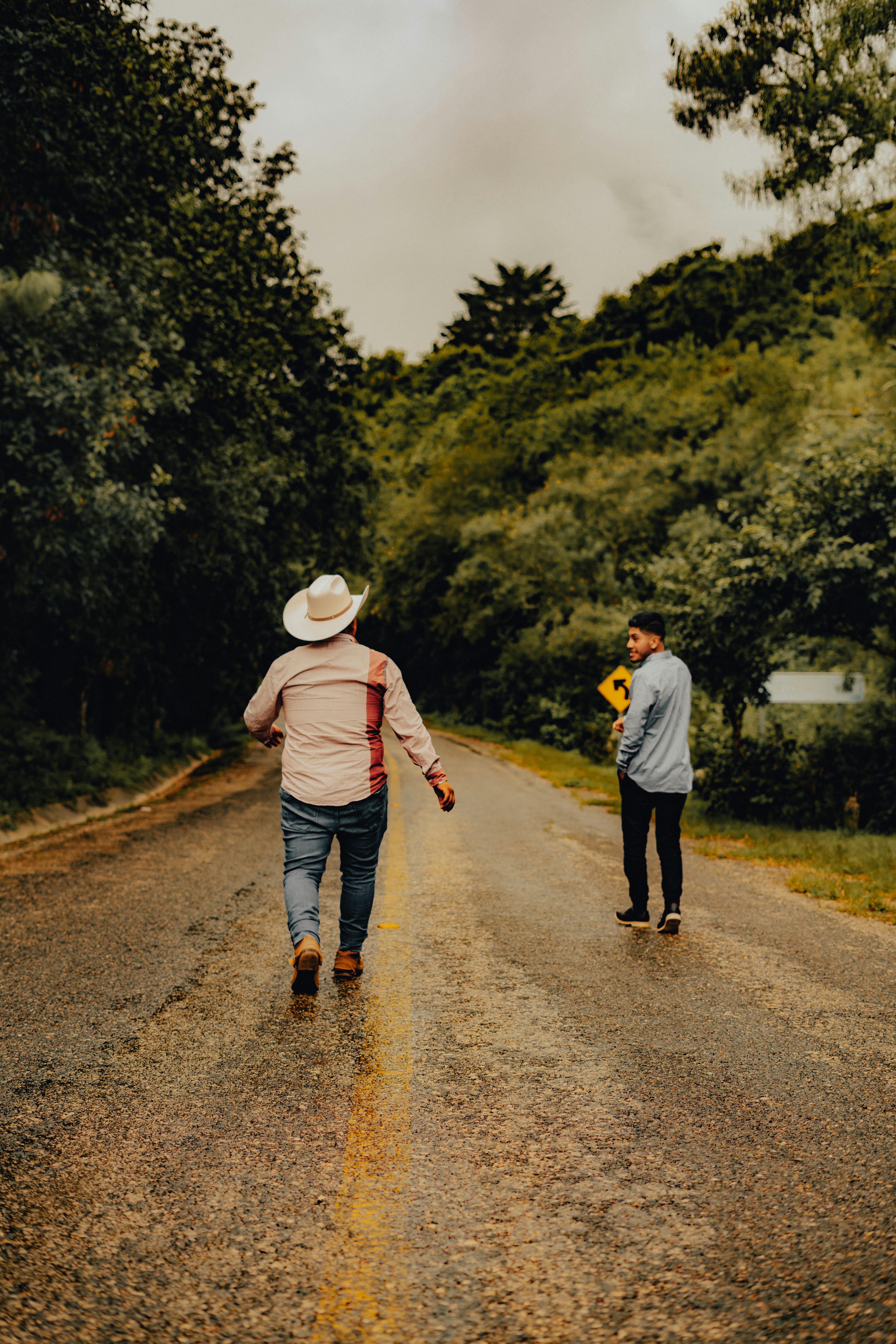 Men Walking on Road · Free Stock Photo