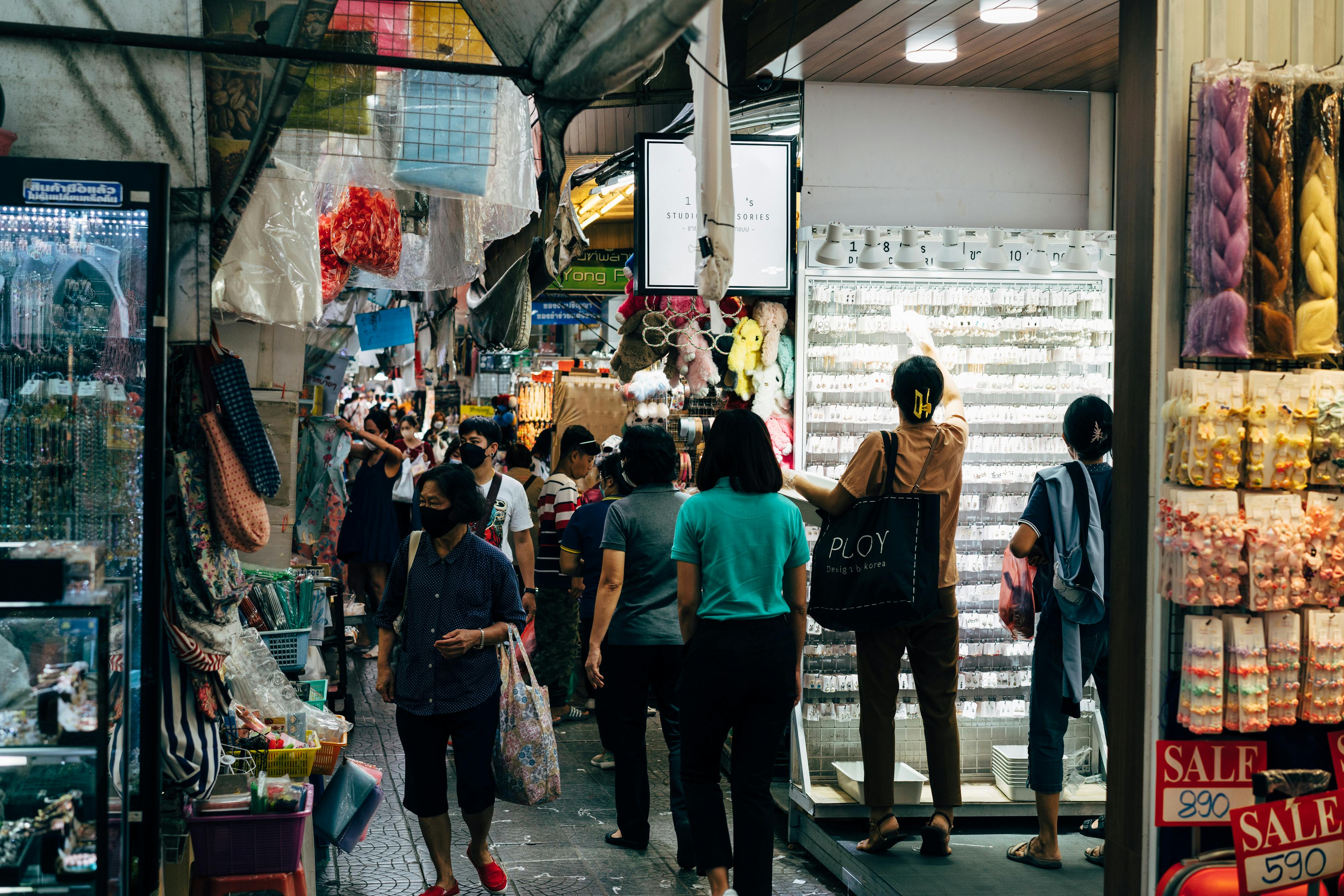 Shoppers Among Tightly Packed Stalls of a Bustling Market · Free Stock ...