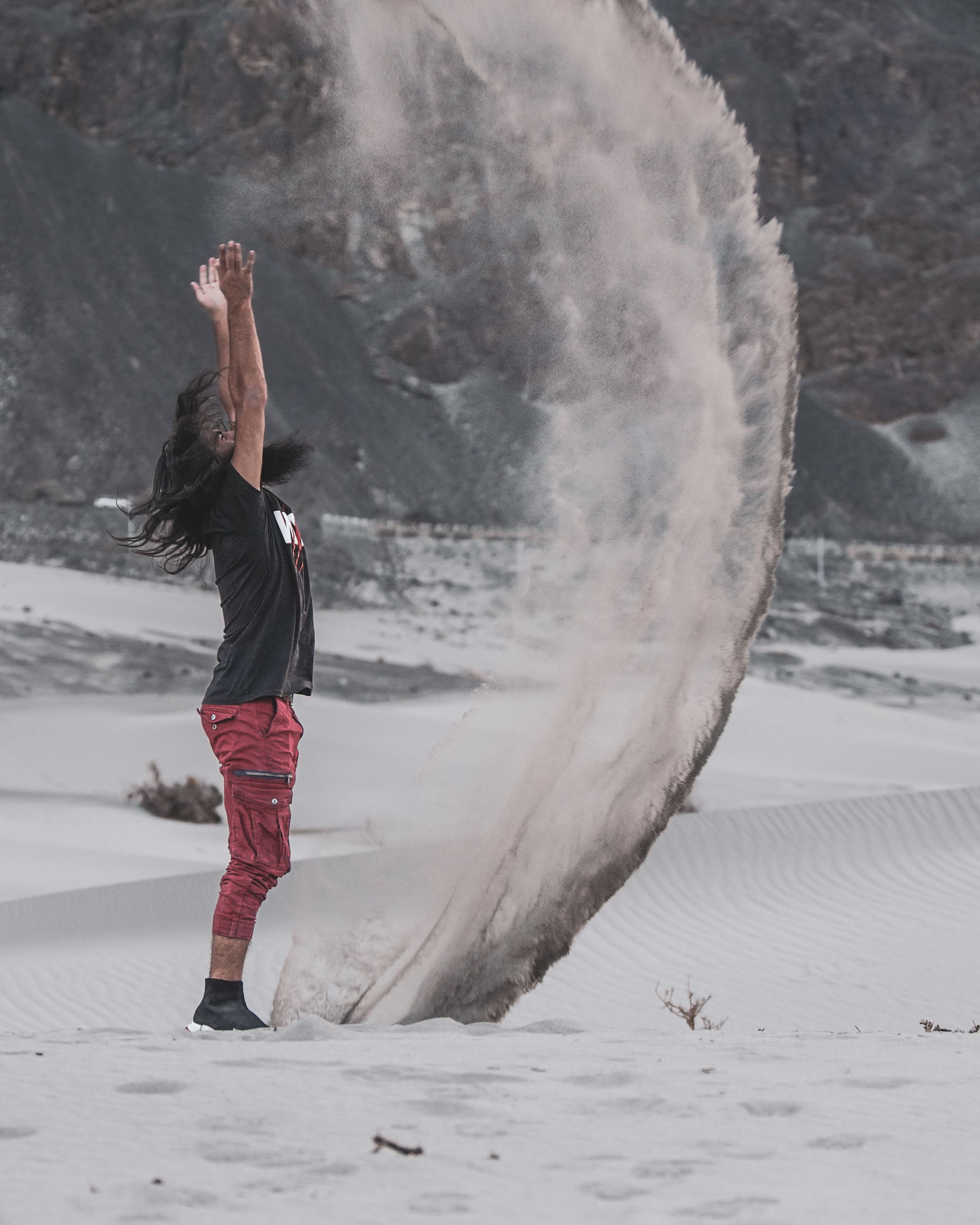 Man with Raised Arms next to a Splash · Free Stock Photo
