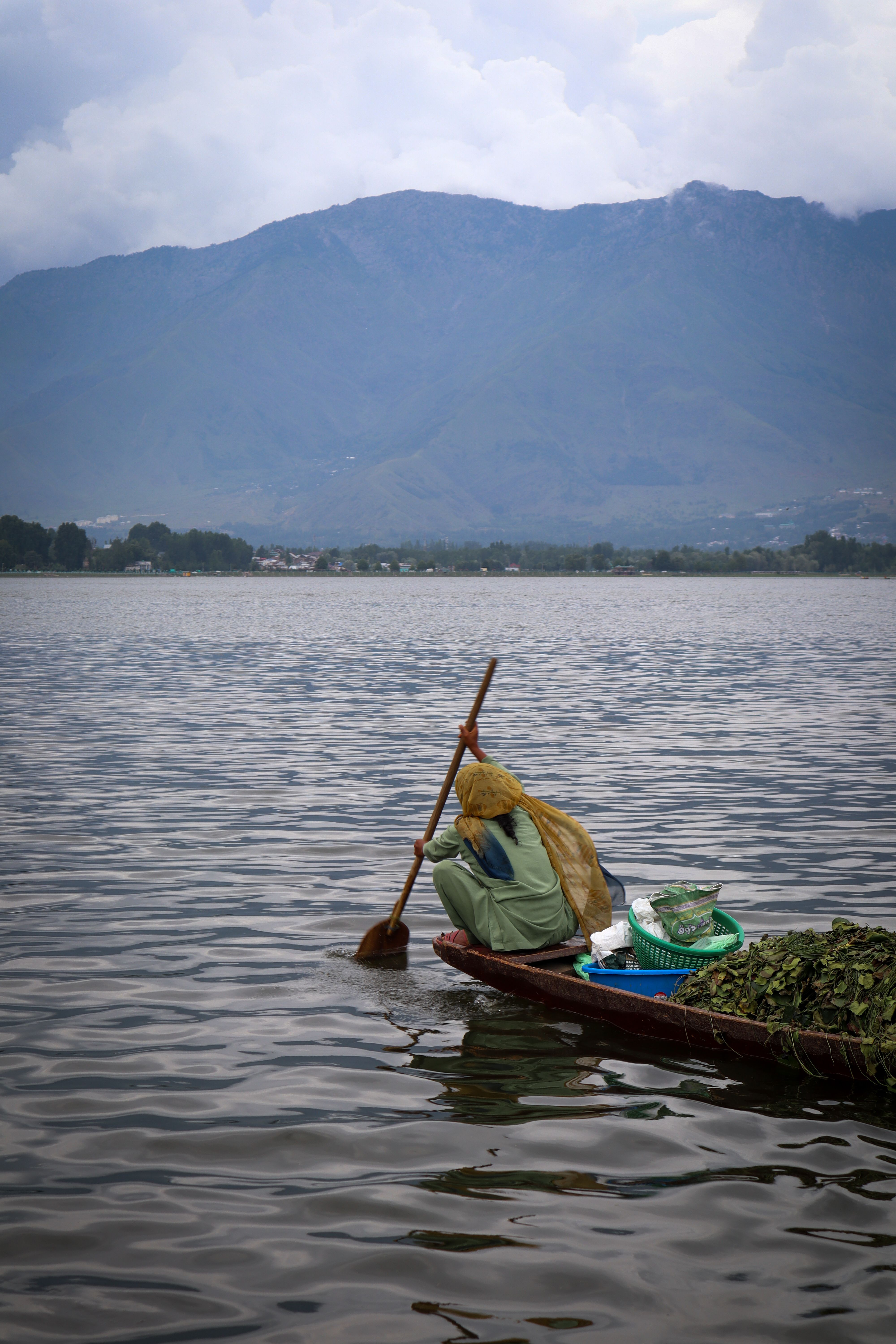 Person Canoeing on Lake near Mountains and Hills · Free Stock Photo
