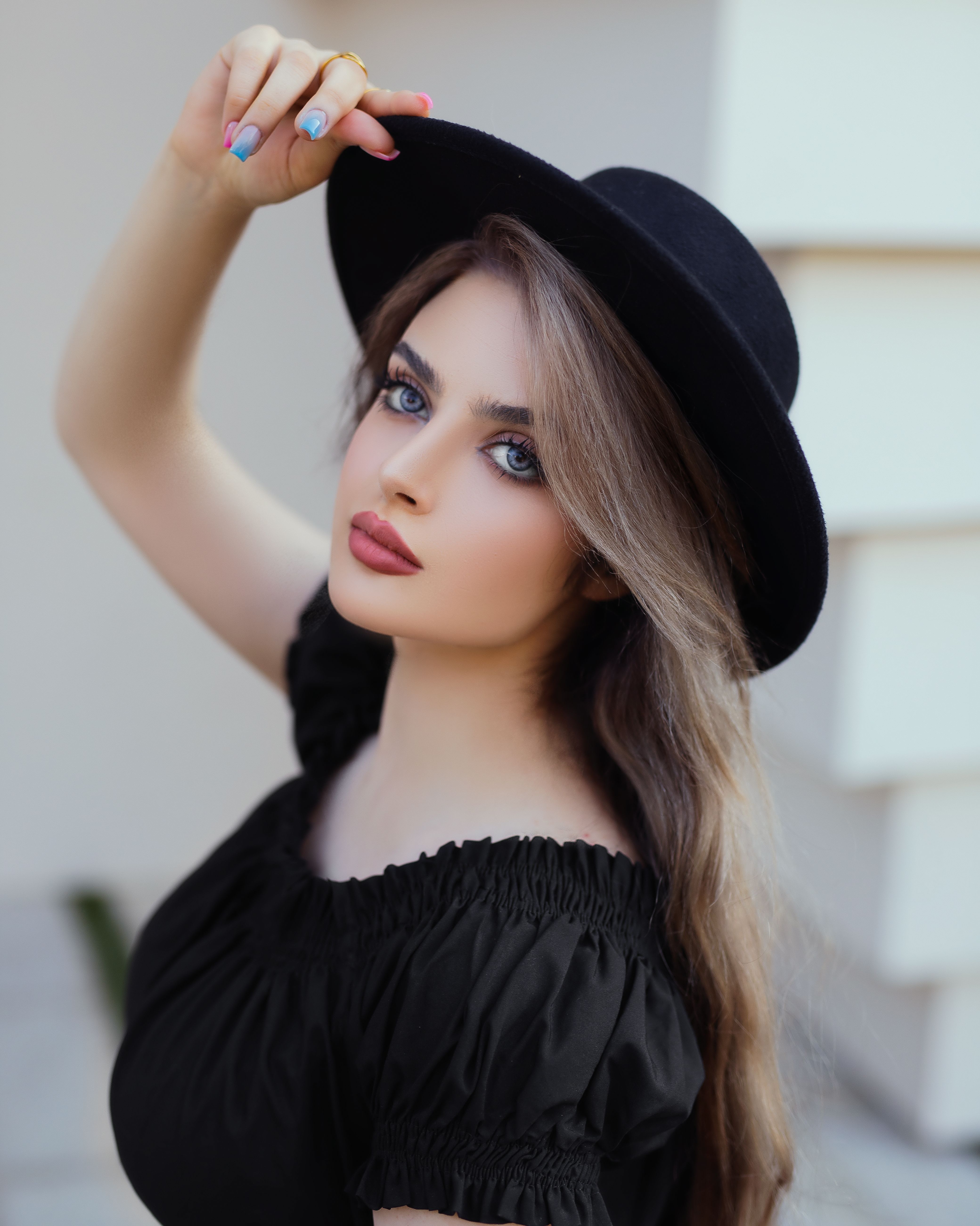 Woman in Black Top Wearing Black Hat · Free Stock Photo