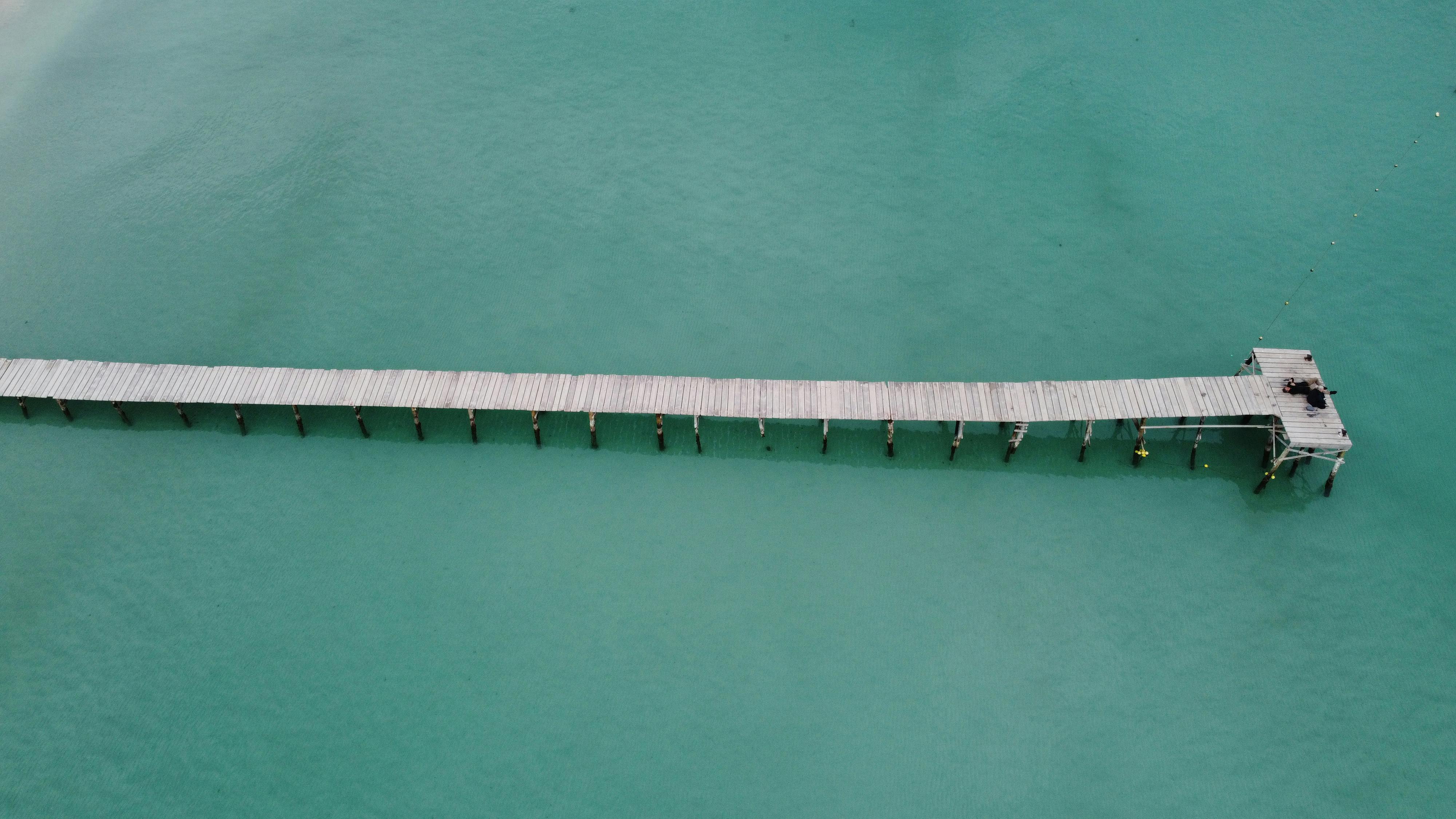 Aerial View of a Wooden Dock on the Sea · Free Stock Photo