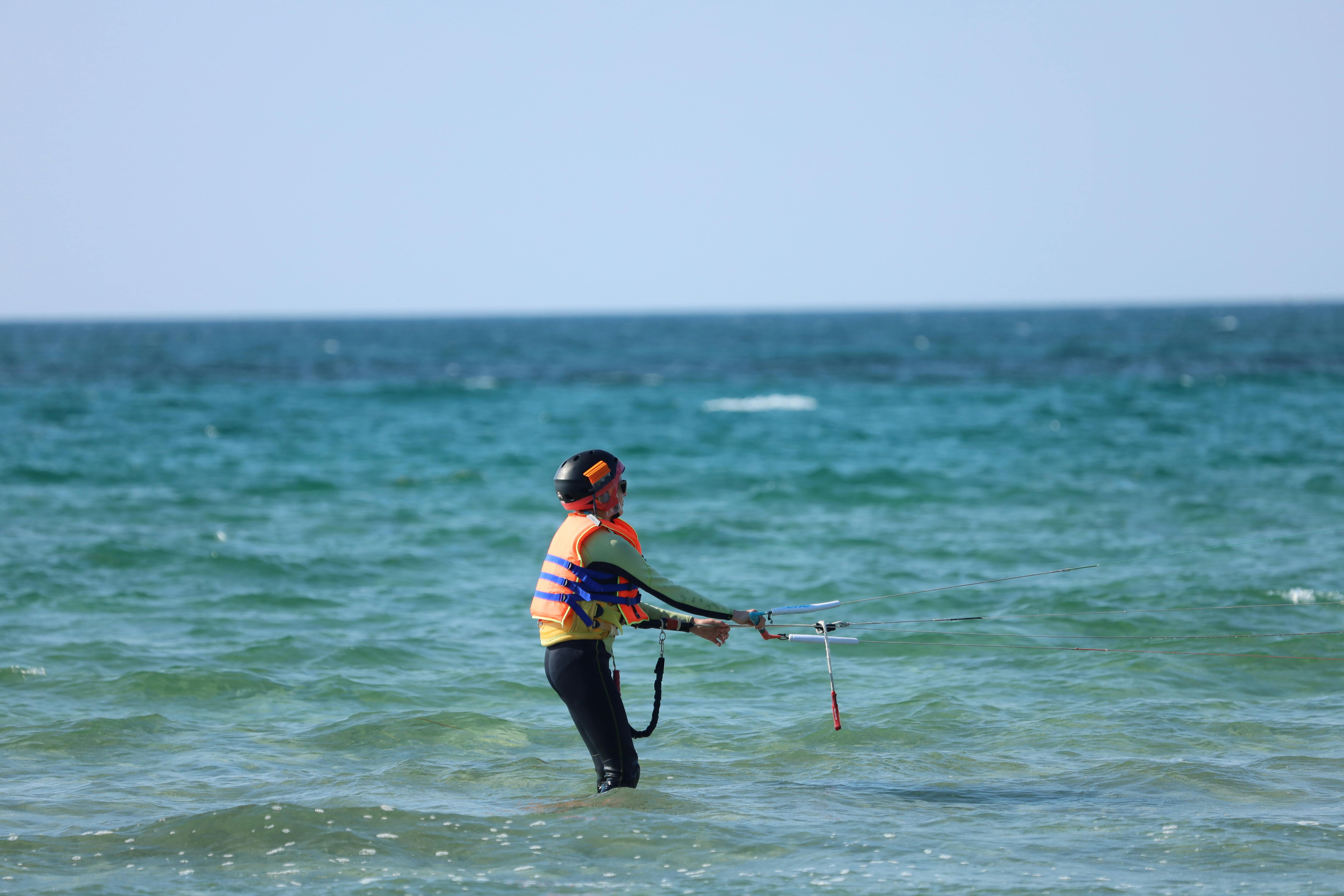 People Holding Lines in Water · Free Stock Photo
