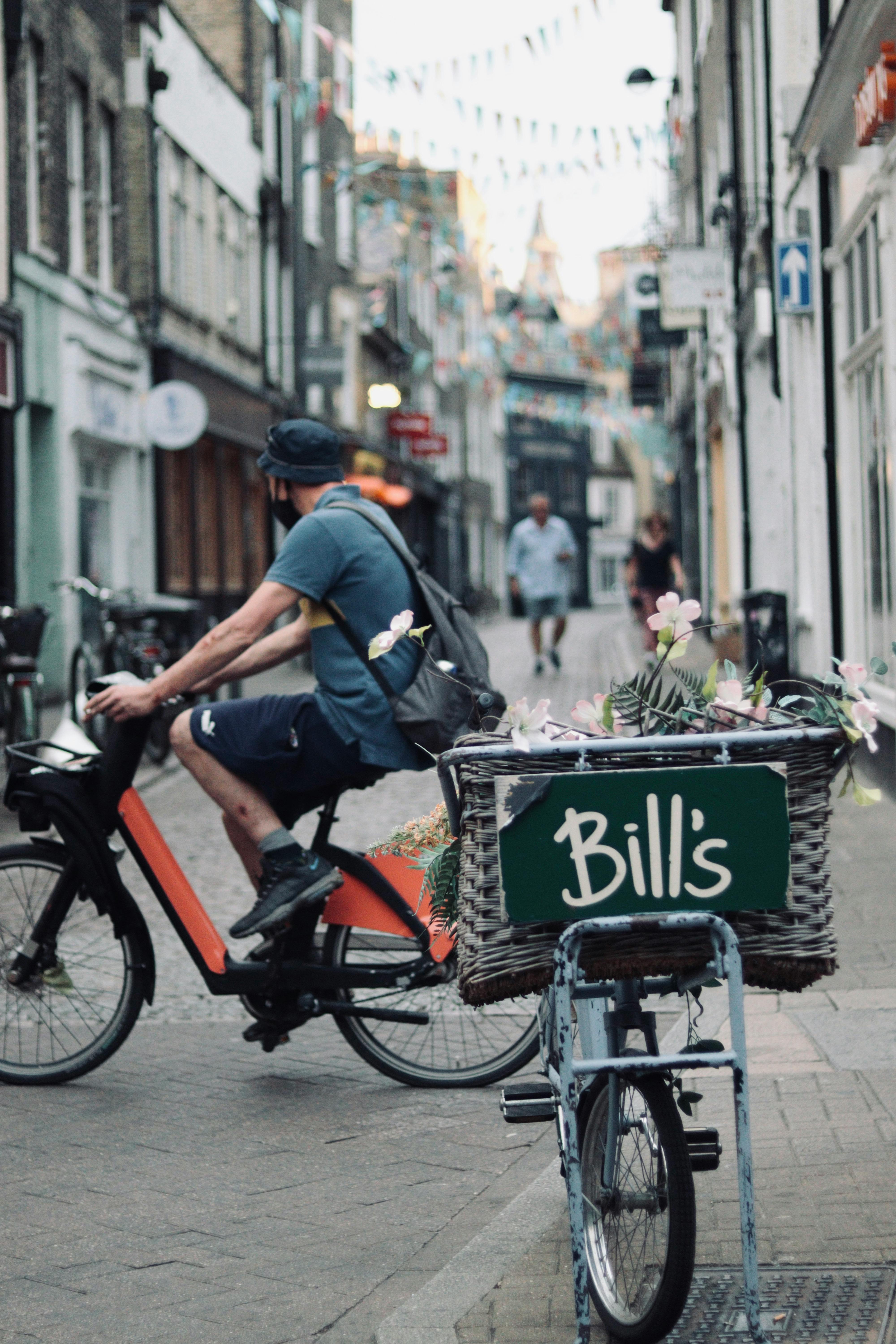 A Man Riding Bicycle on the Street · Free Stock Photo