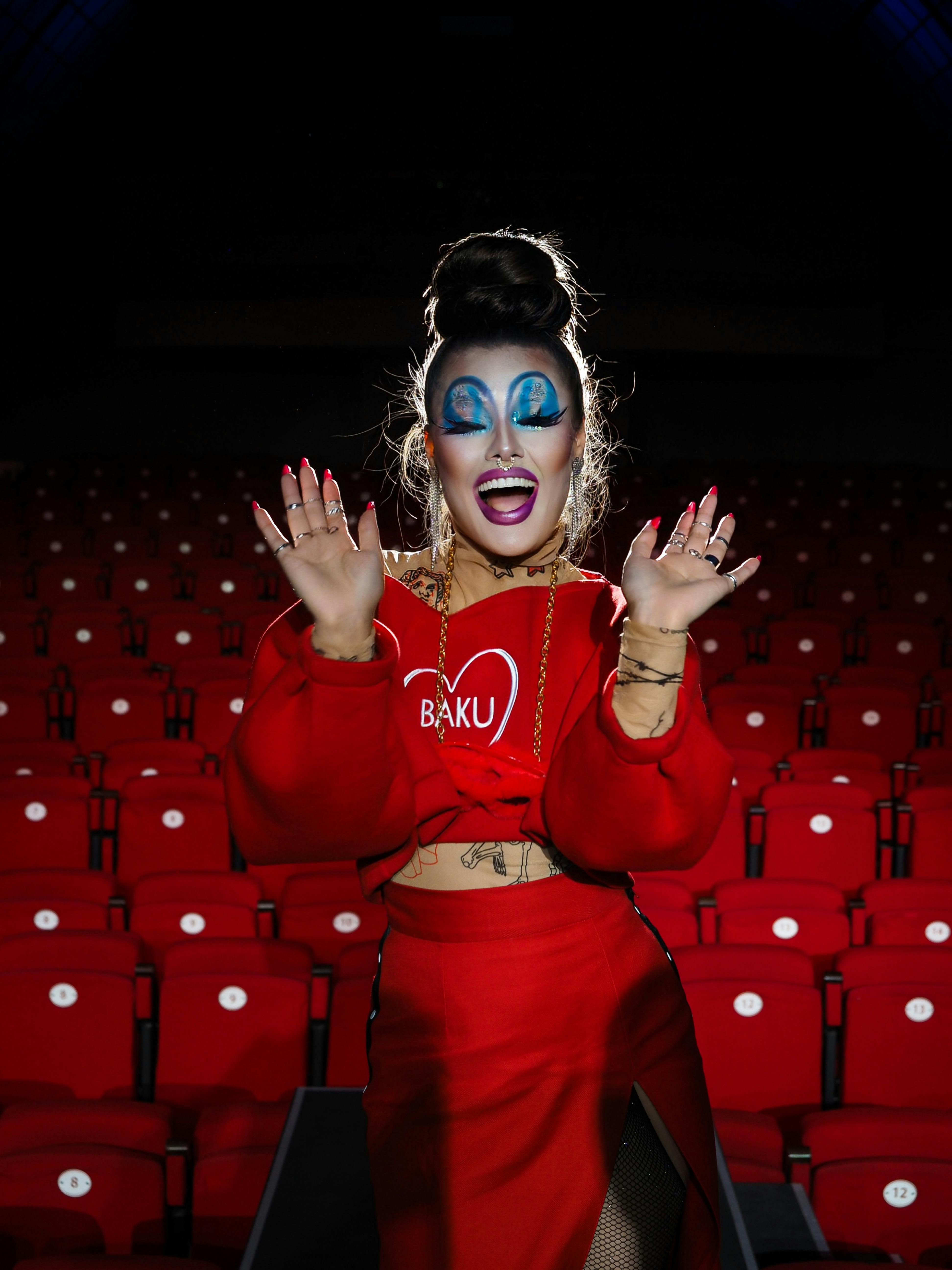 Woman in Eccentric Outfit in Theater · Free Stock Photo