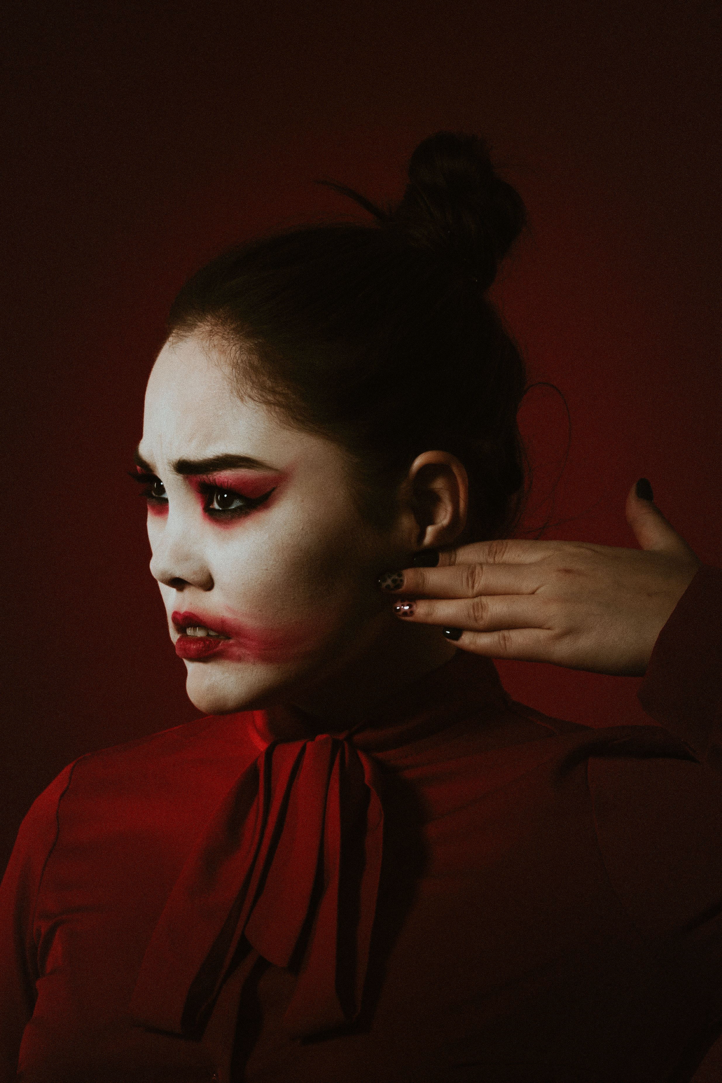 Woman Smudging Makeup on Face · Free Stock Photo
