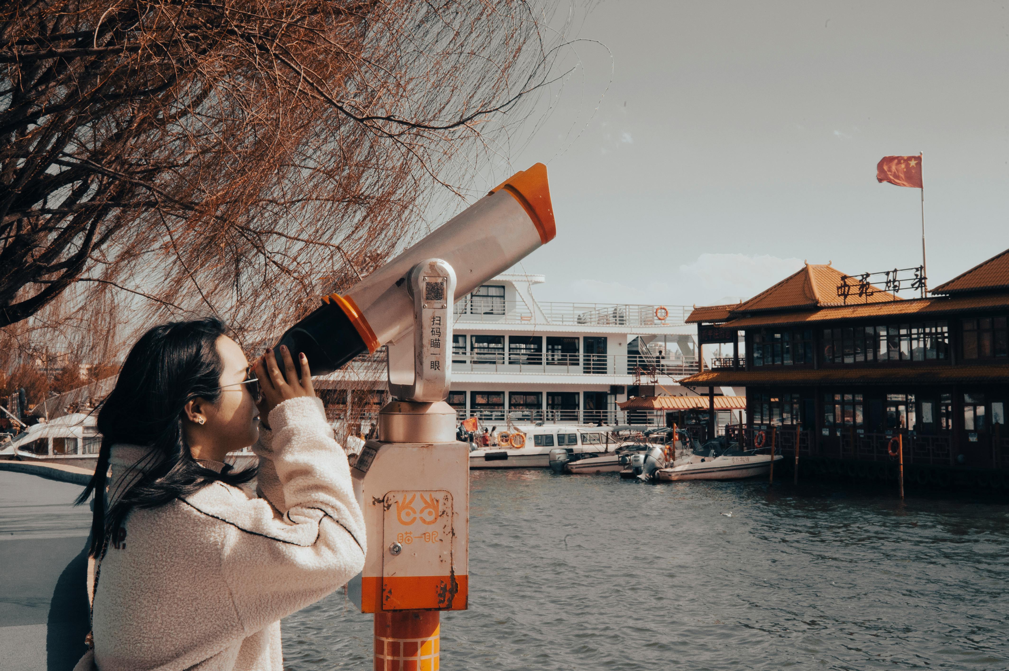 Woman Using Telescope · Free Stock Photo