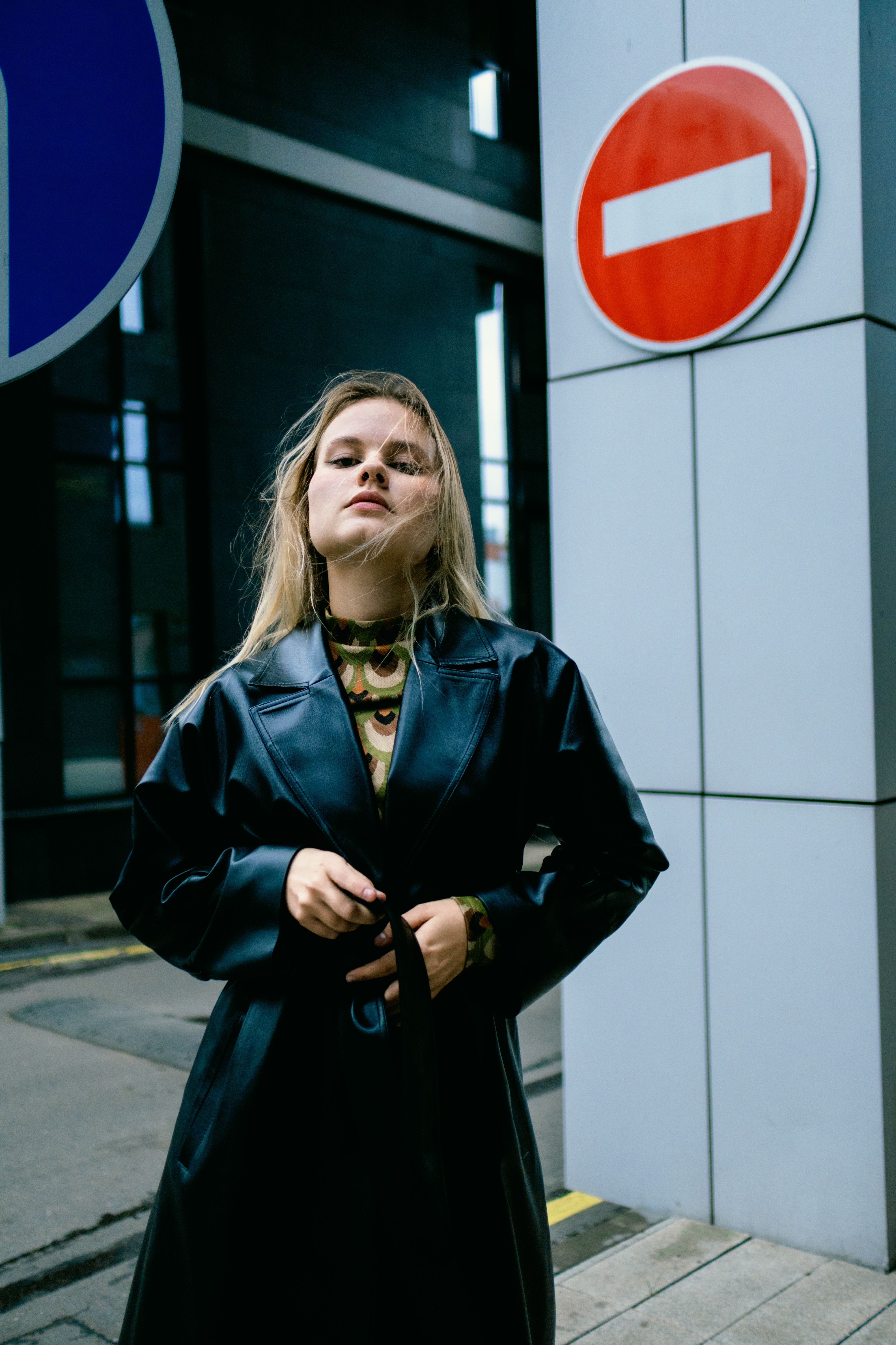Person in Leather Coat Standing on Road · Free Stock Photo