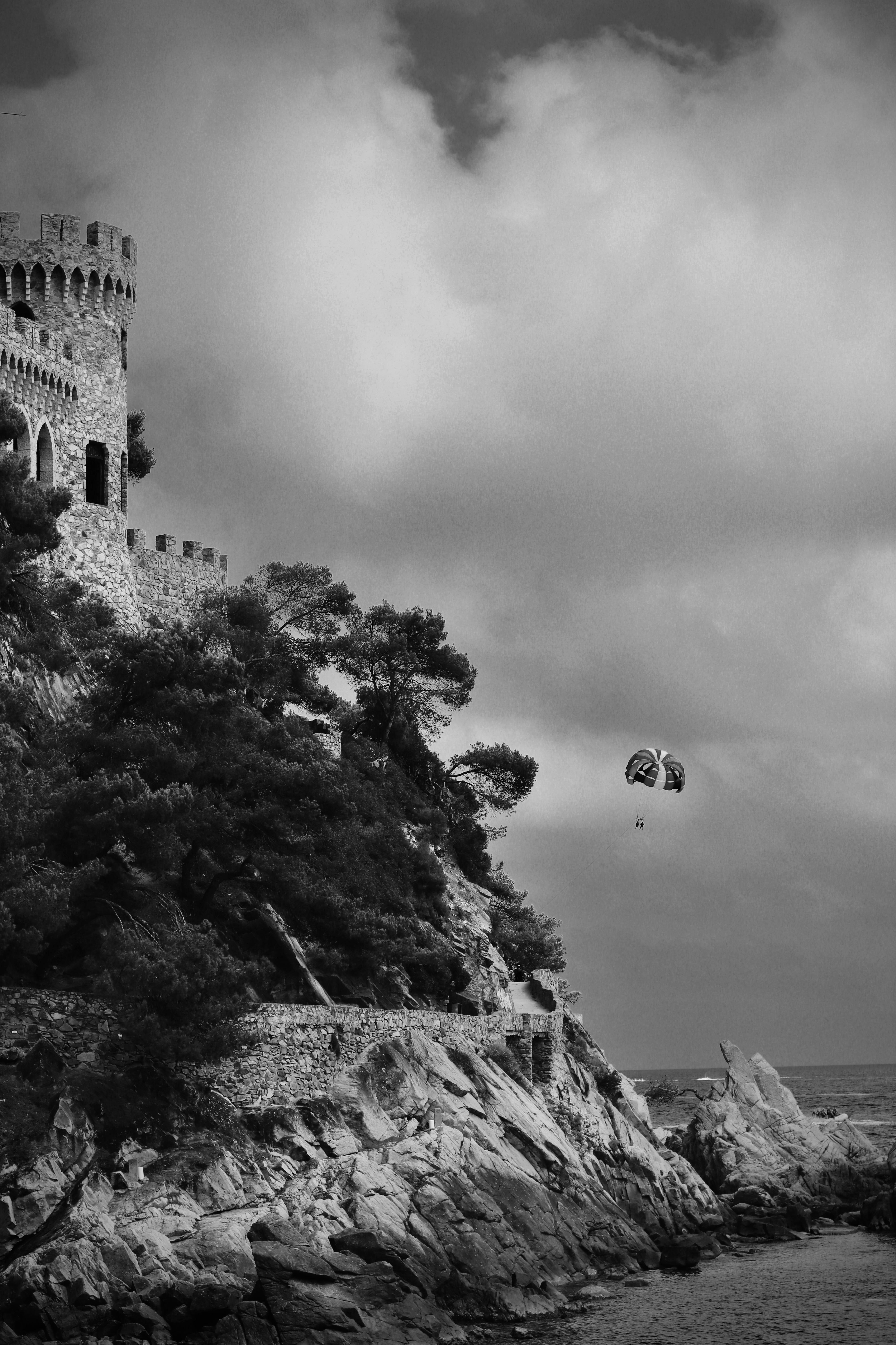 Grayscale Photo of Castle on Cliff · Free Stock Photo