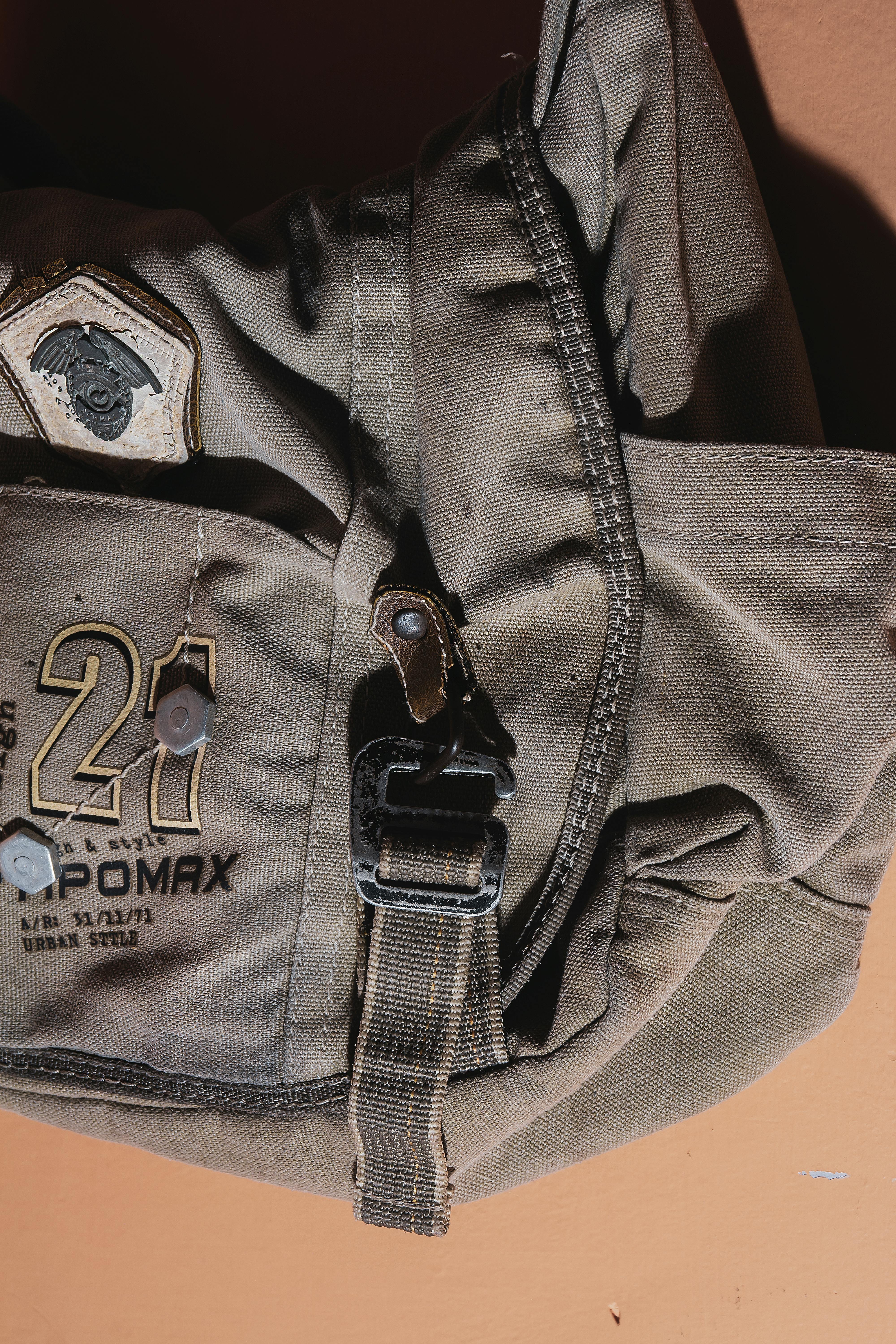 Blue and Brown Backpack on the Ground · Free Stock Photo